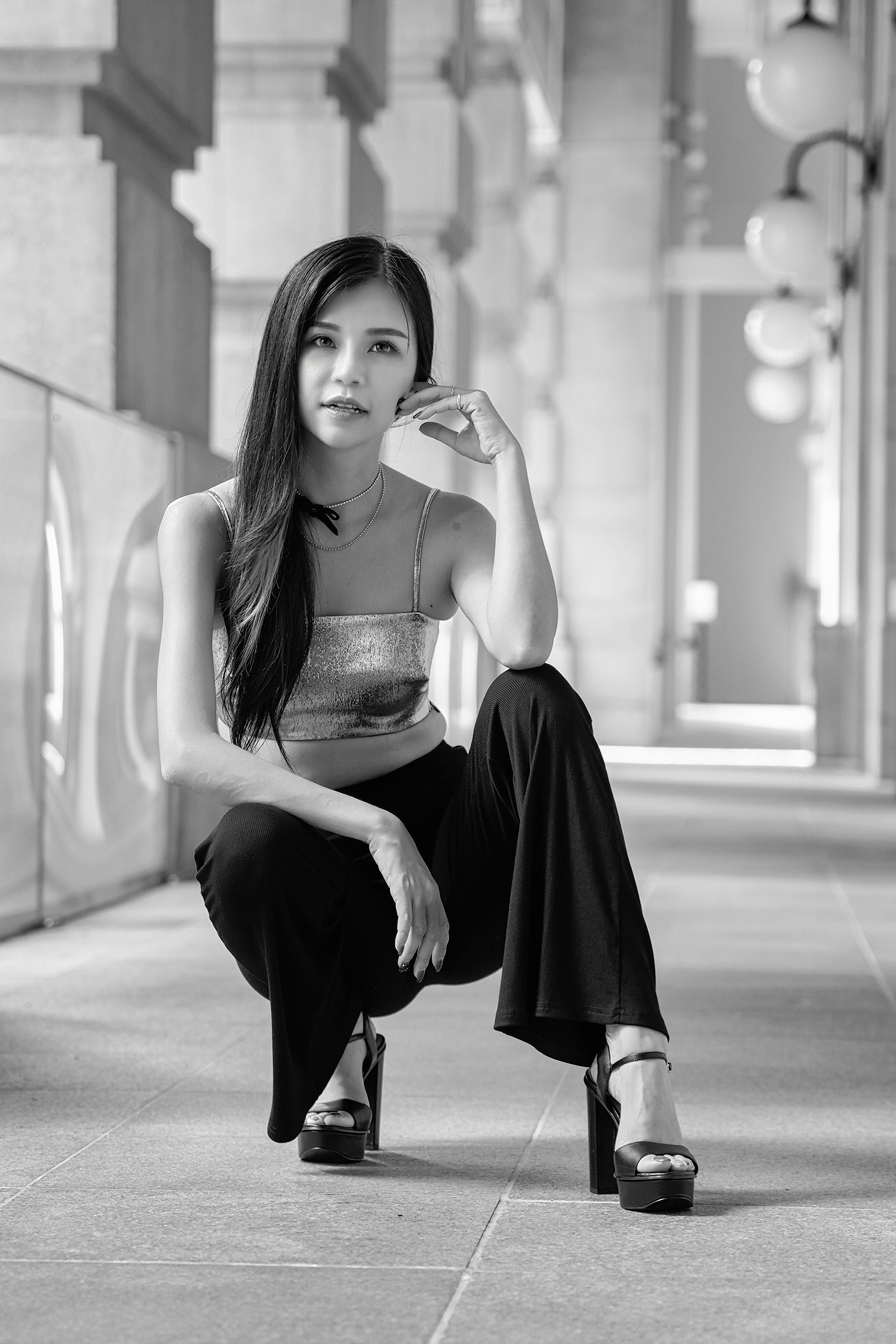 Woman Crouching on Pavement and Posing · Free Stock Photo