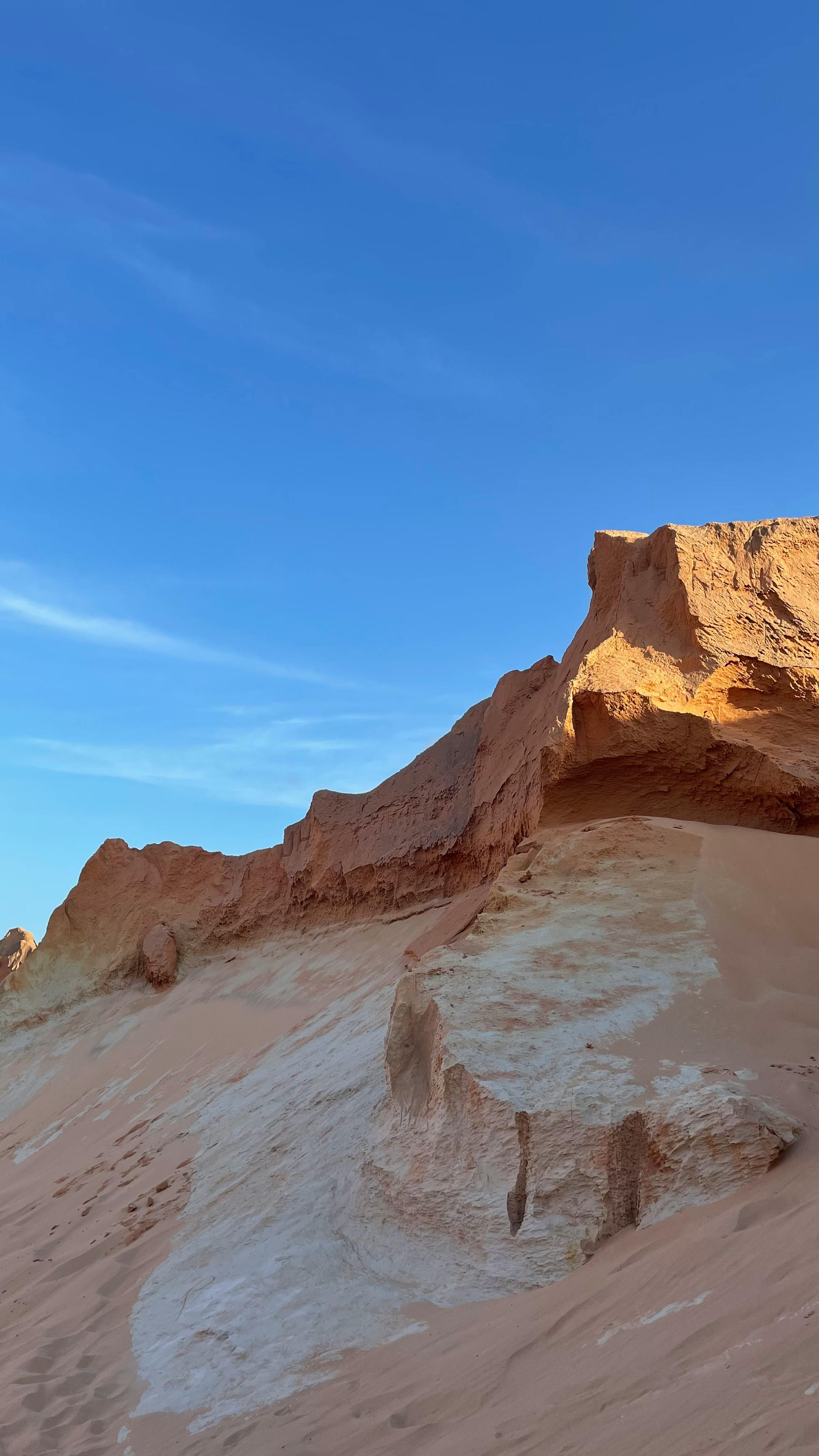 Sharp Rocky Mountain Peak and Rock in Pond · Free Stock Photo