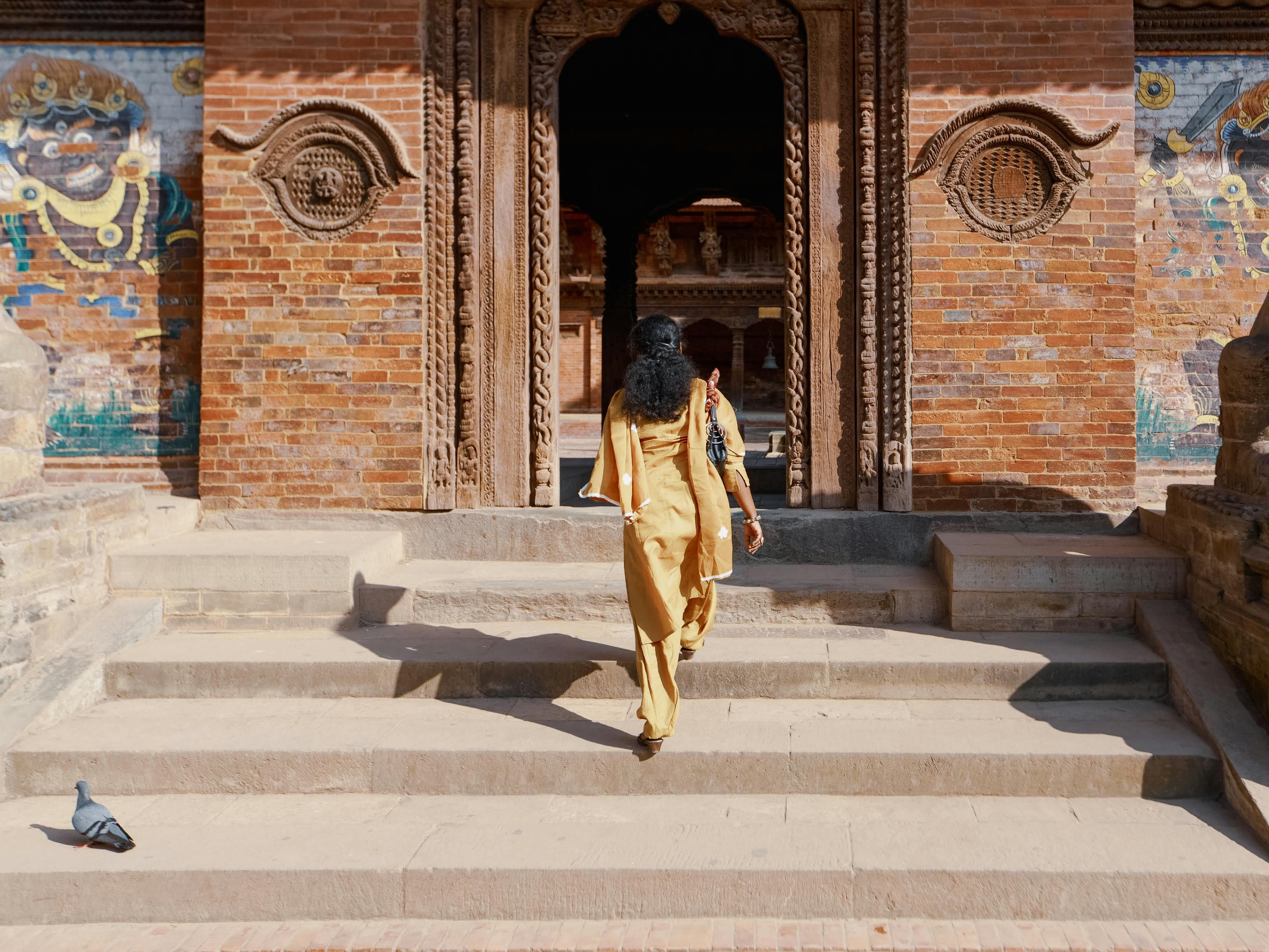 Woman on Steps of Hindu Monastery · Free Stock Photo