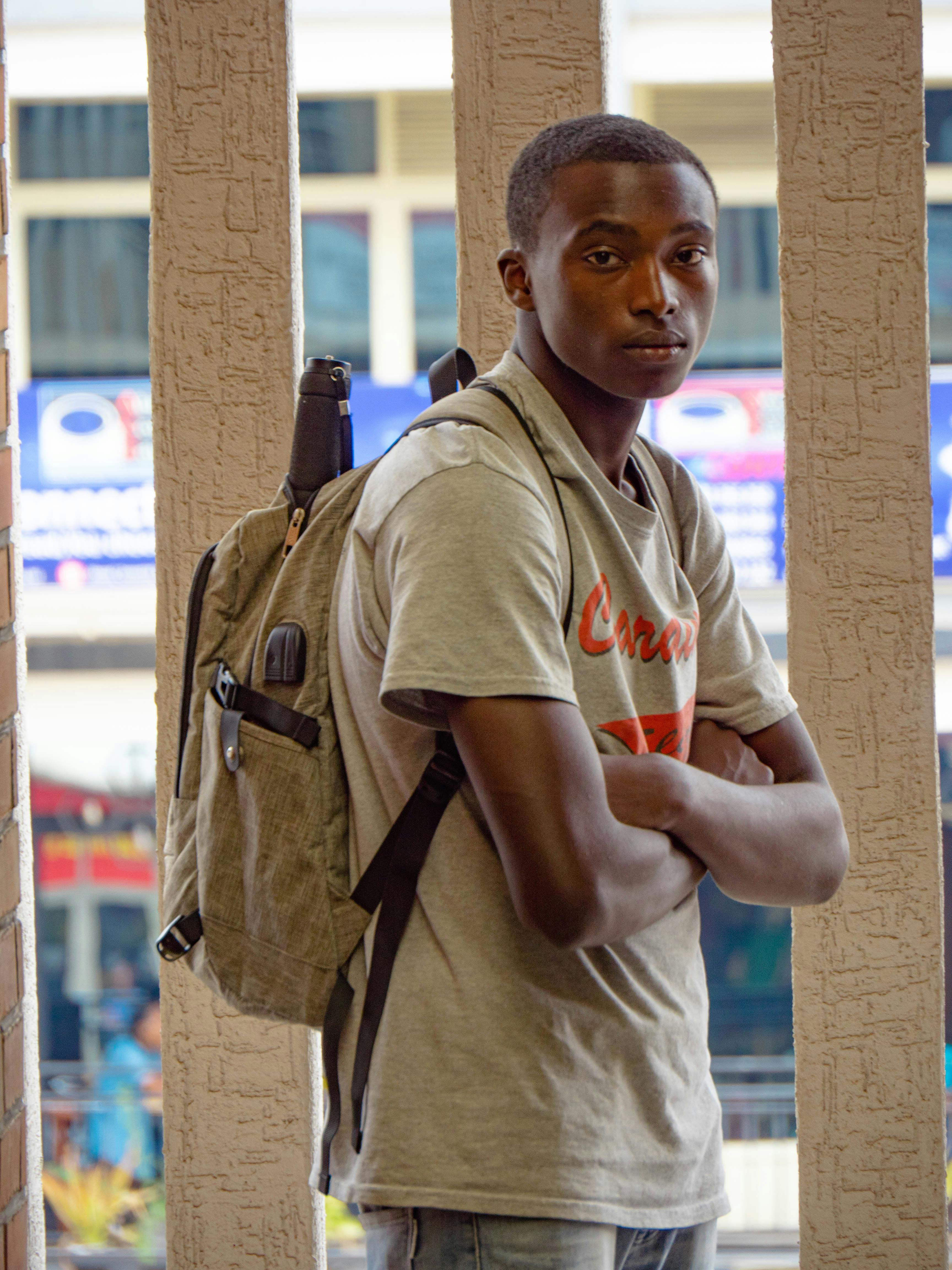 Young Men in Front of Shipping Container · Free Stock Photo