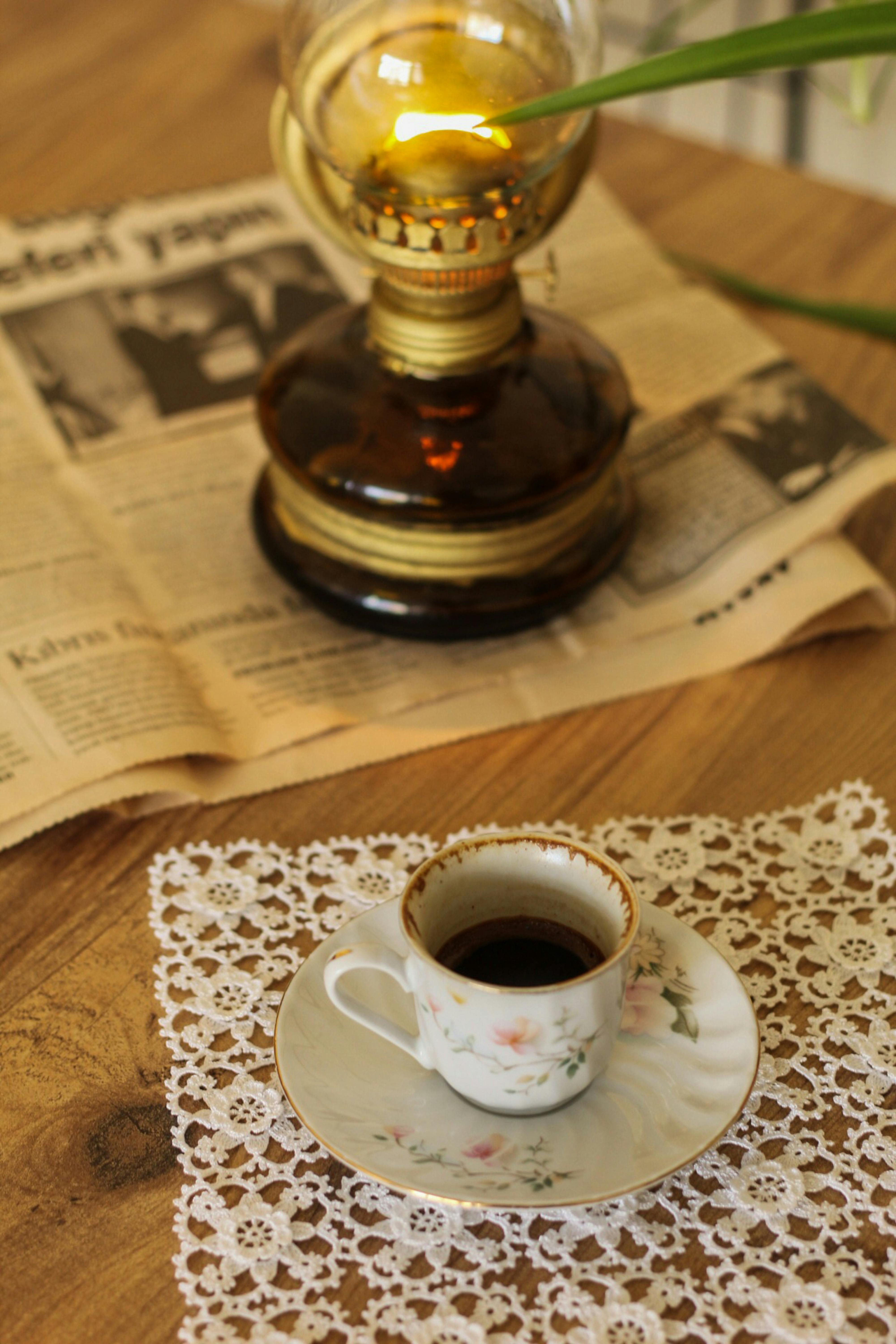 Retro Lamp and Newspaper on Wooden Table · Free Stock Photo
