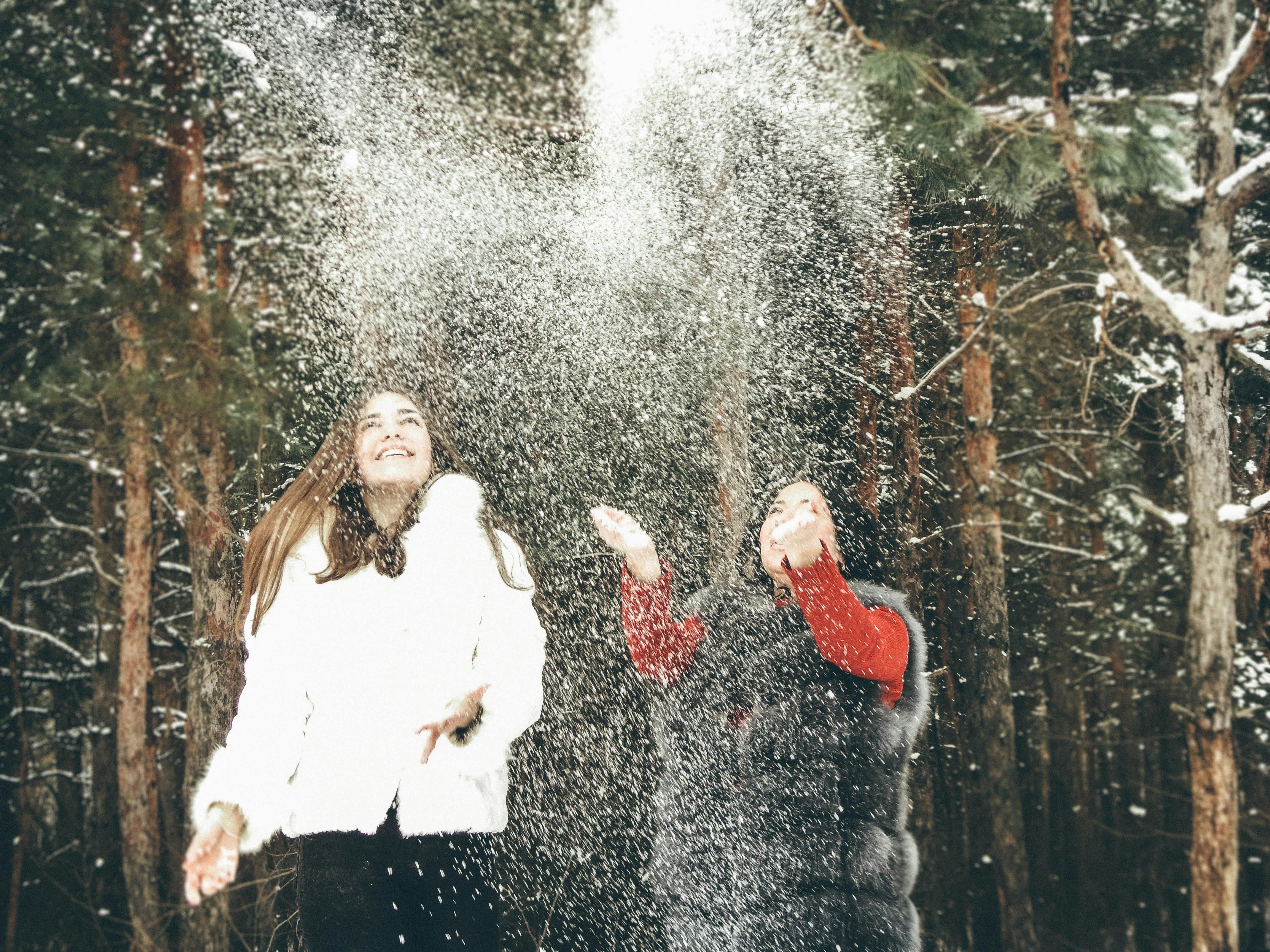 Women Throwing Snow in Winter · Free Stock Photo