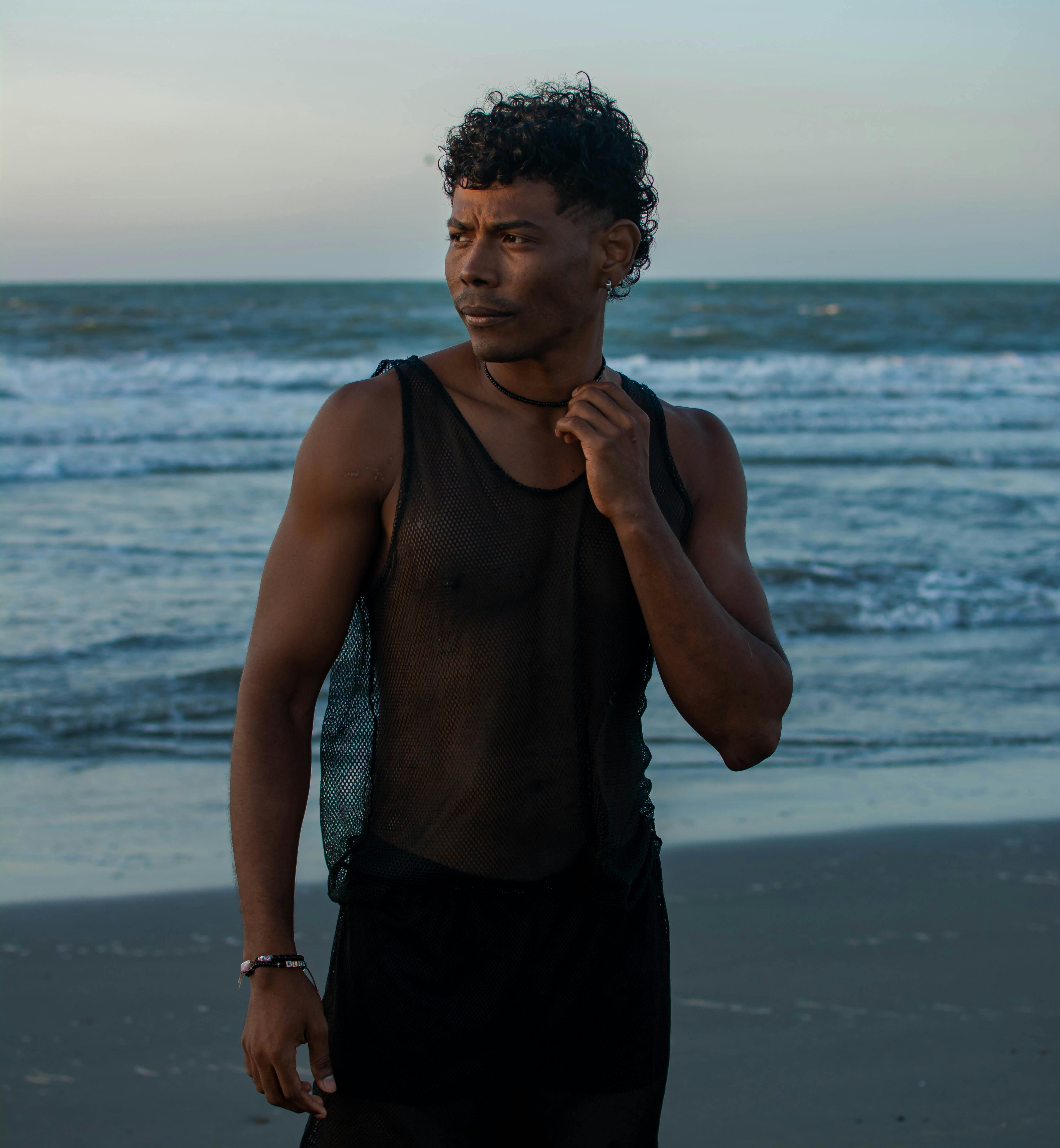 Man in Transparent Tank Top at Beach · Free Stock Photo