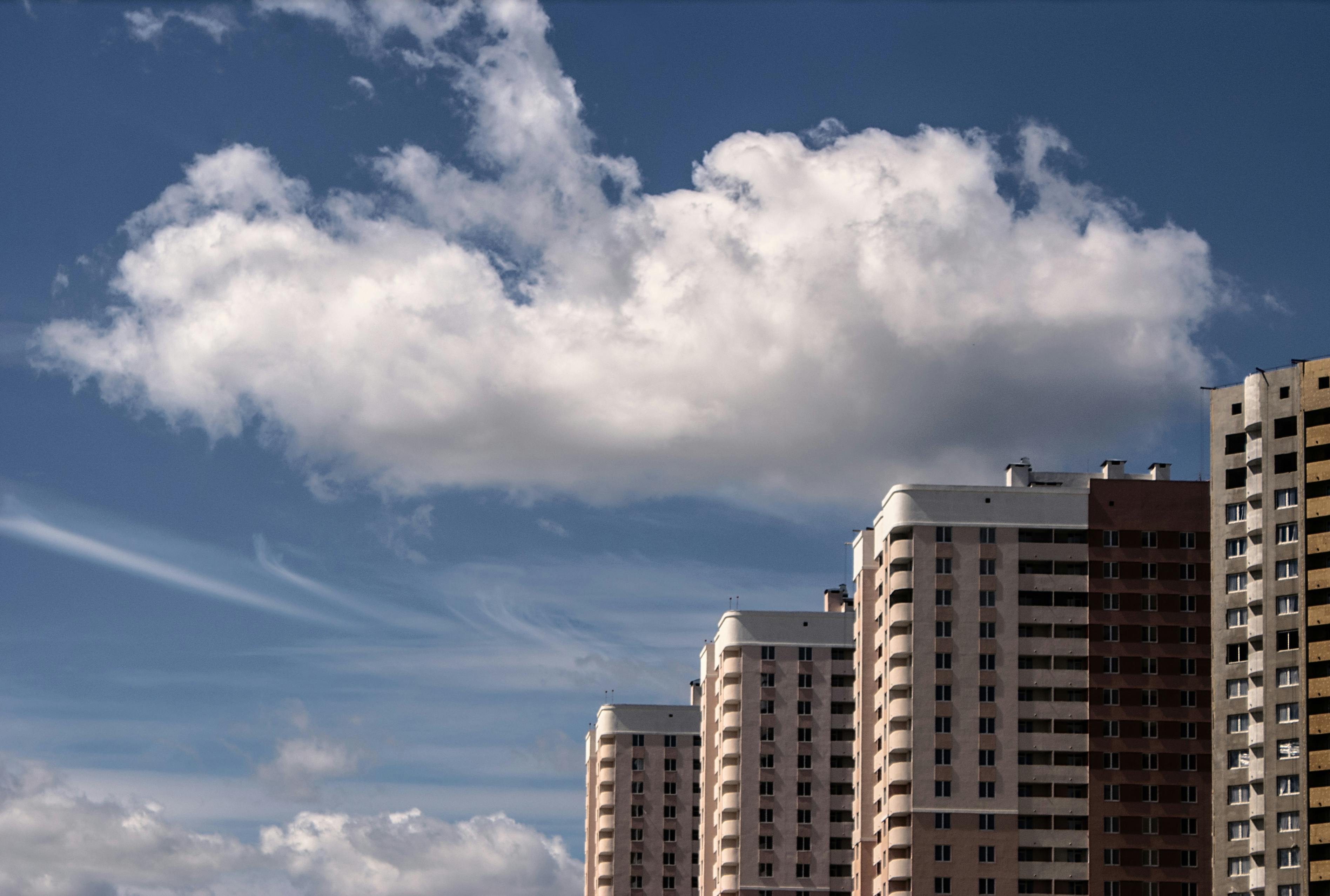 Residential Buildings Under Cloudy Sky · Free Stock Photo