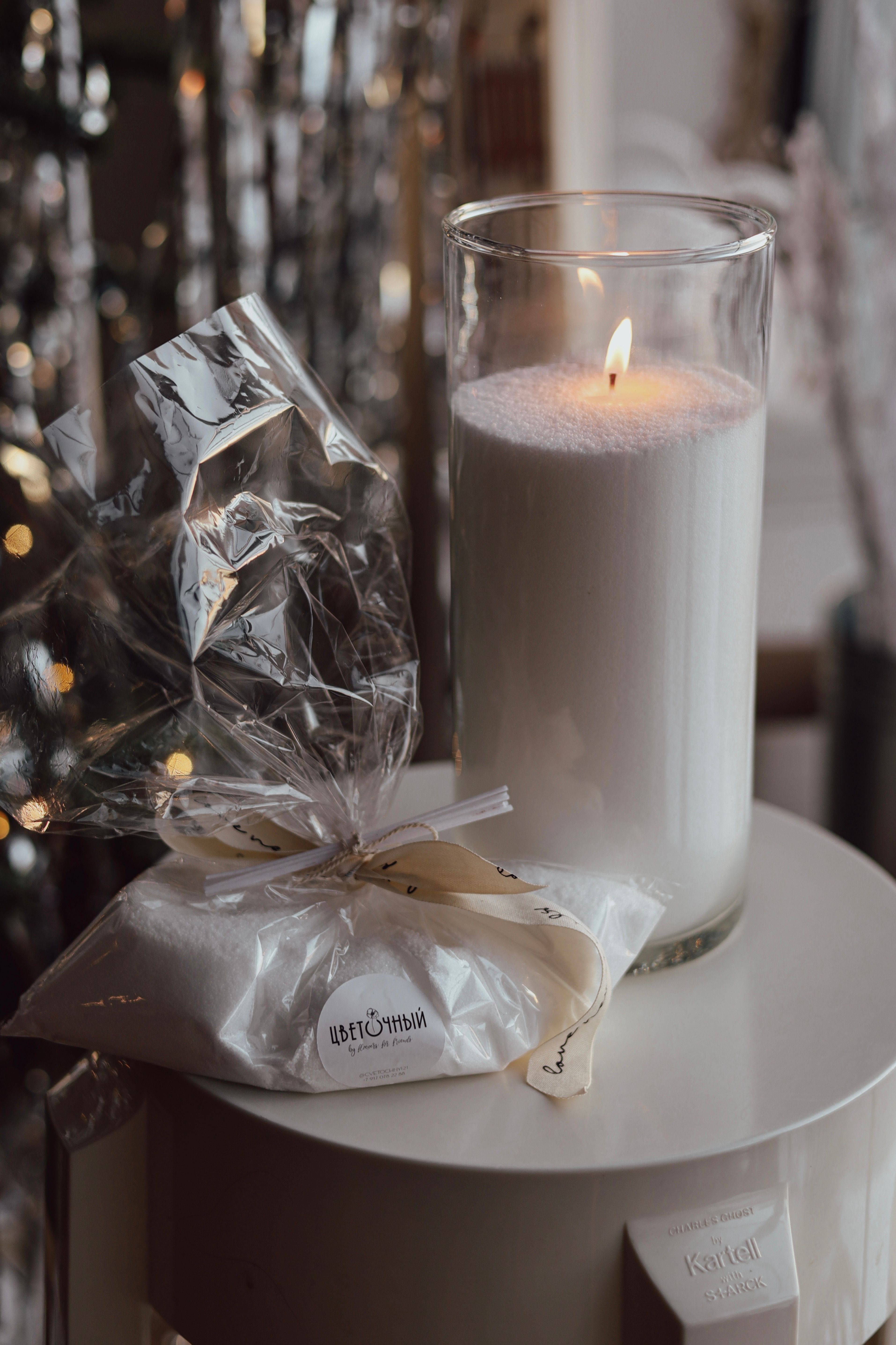 Open Book among Scented Candles · Free Stock Photo