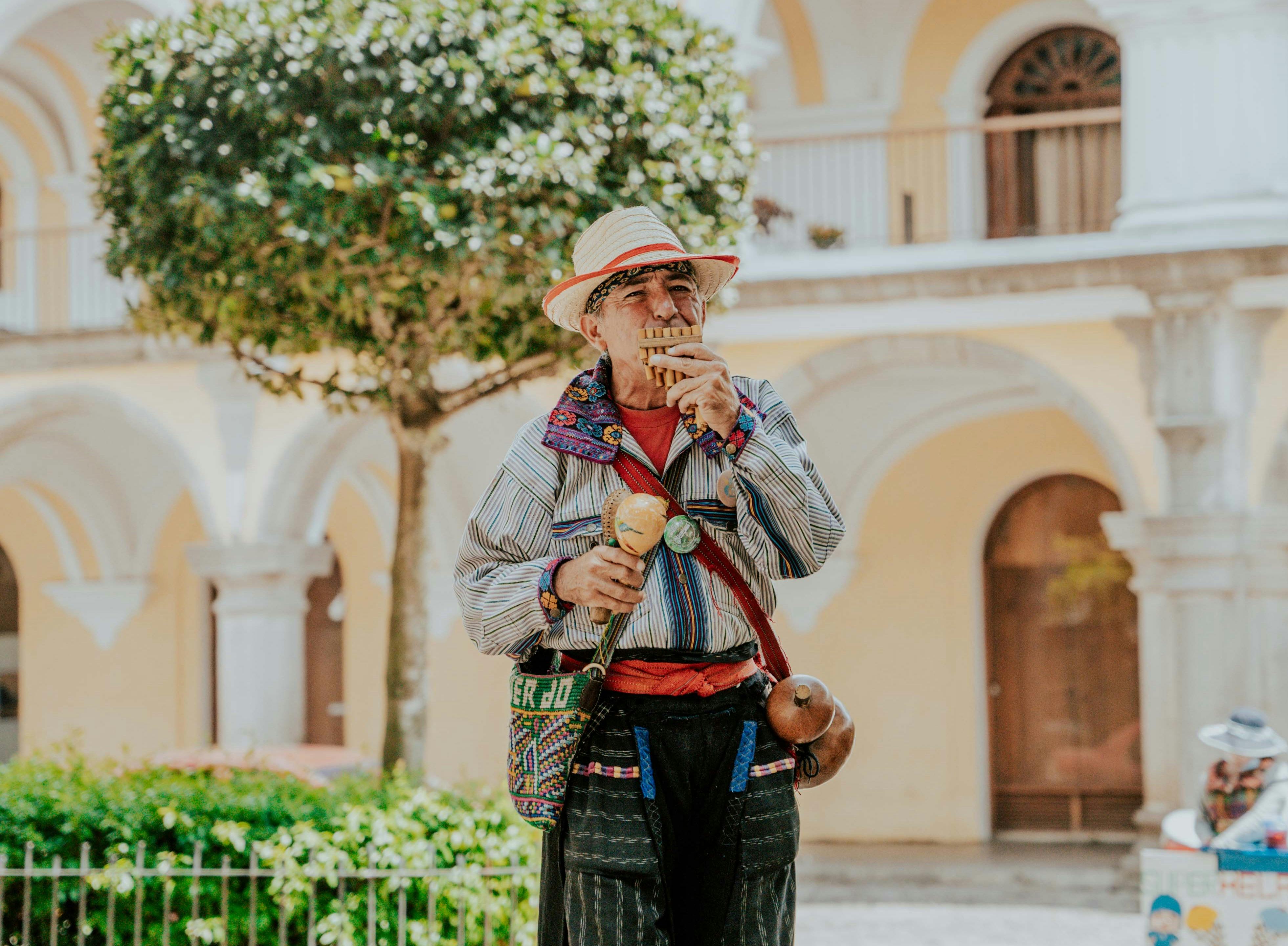 Street Musician with Pan Flute and Maracas · Free Stock Photo
