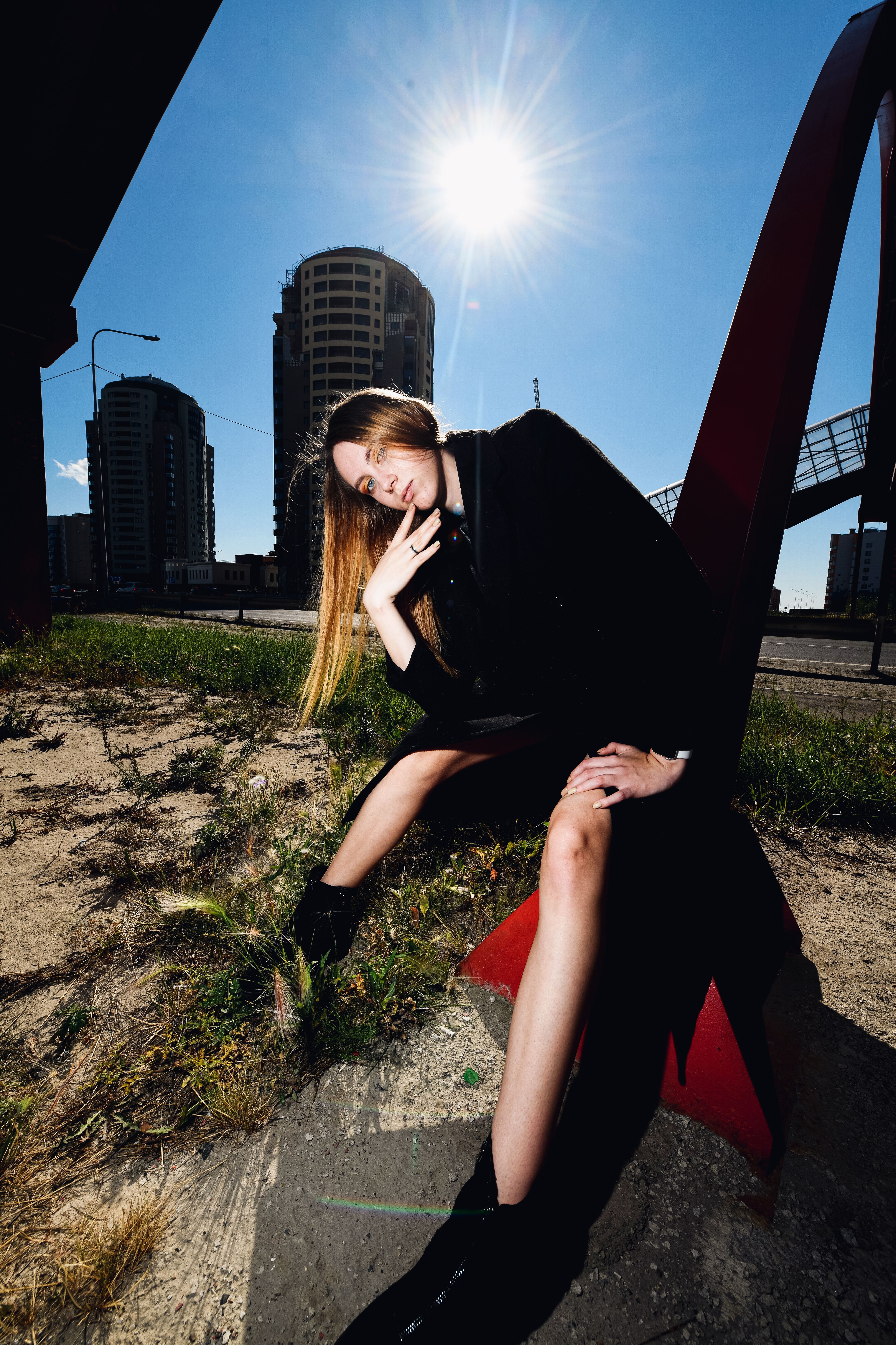 Woman in Black Coat Leaning against Pole · Free Stock Photo