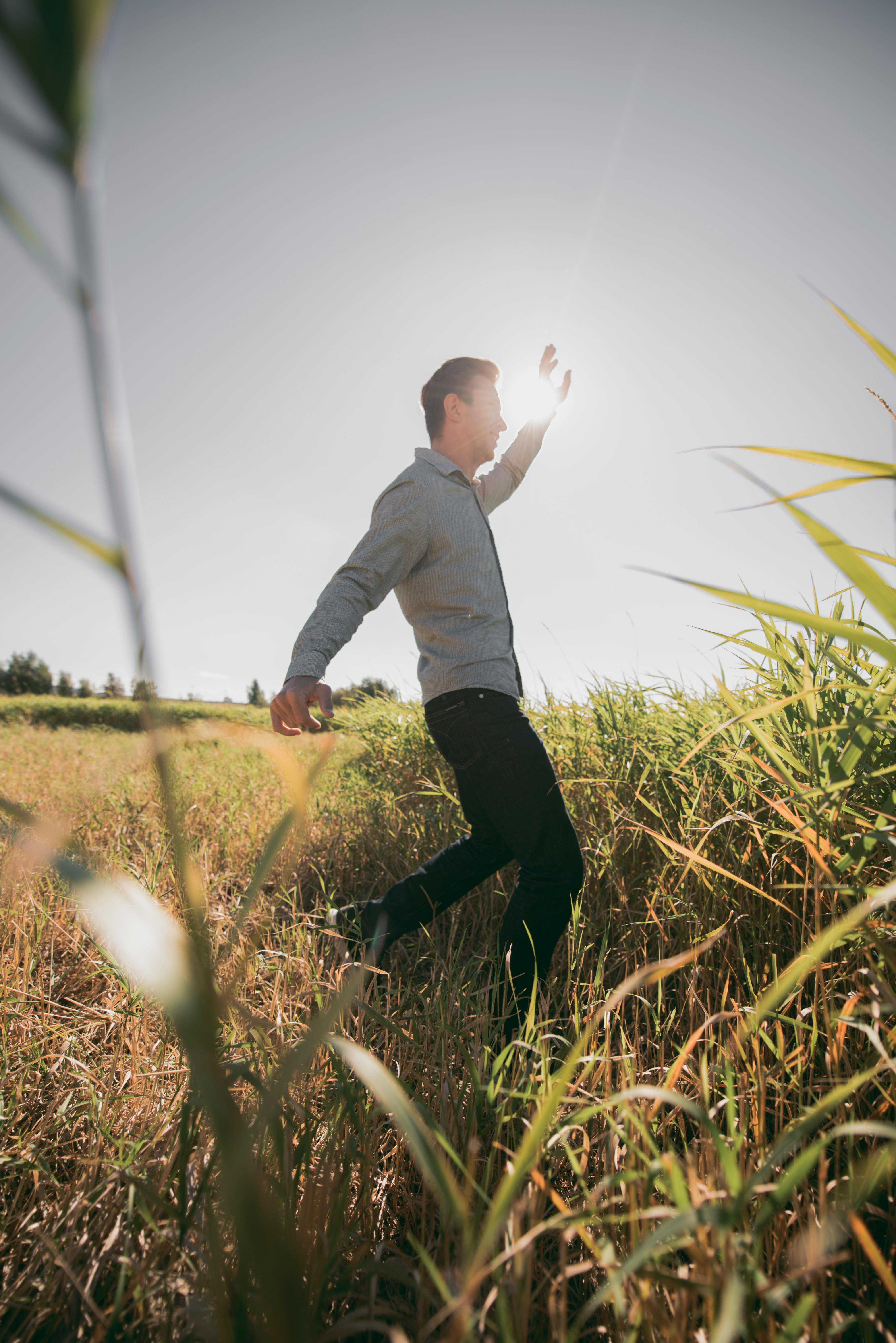 Man Standing in Corn Field · Free Stock Photo