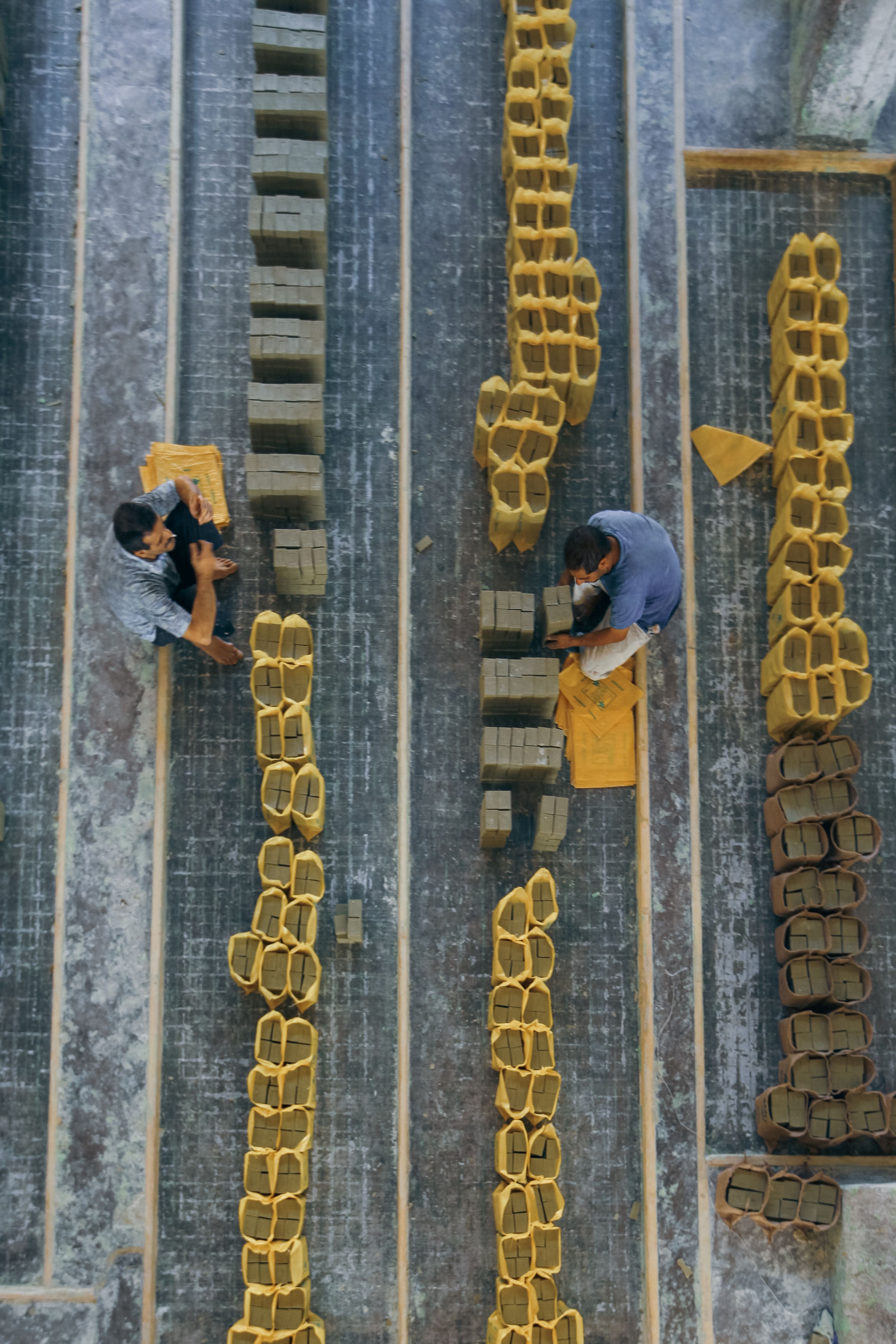 Top View of Two Men Laying Concrete Paving Blocks · Free Stock Photo