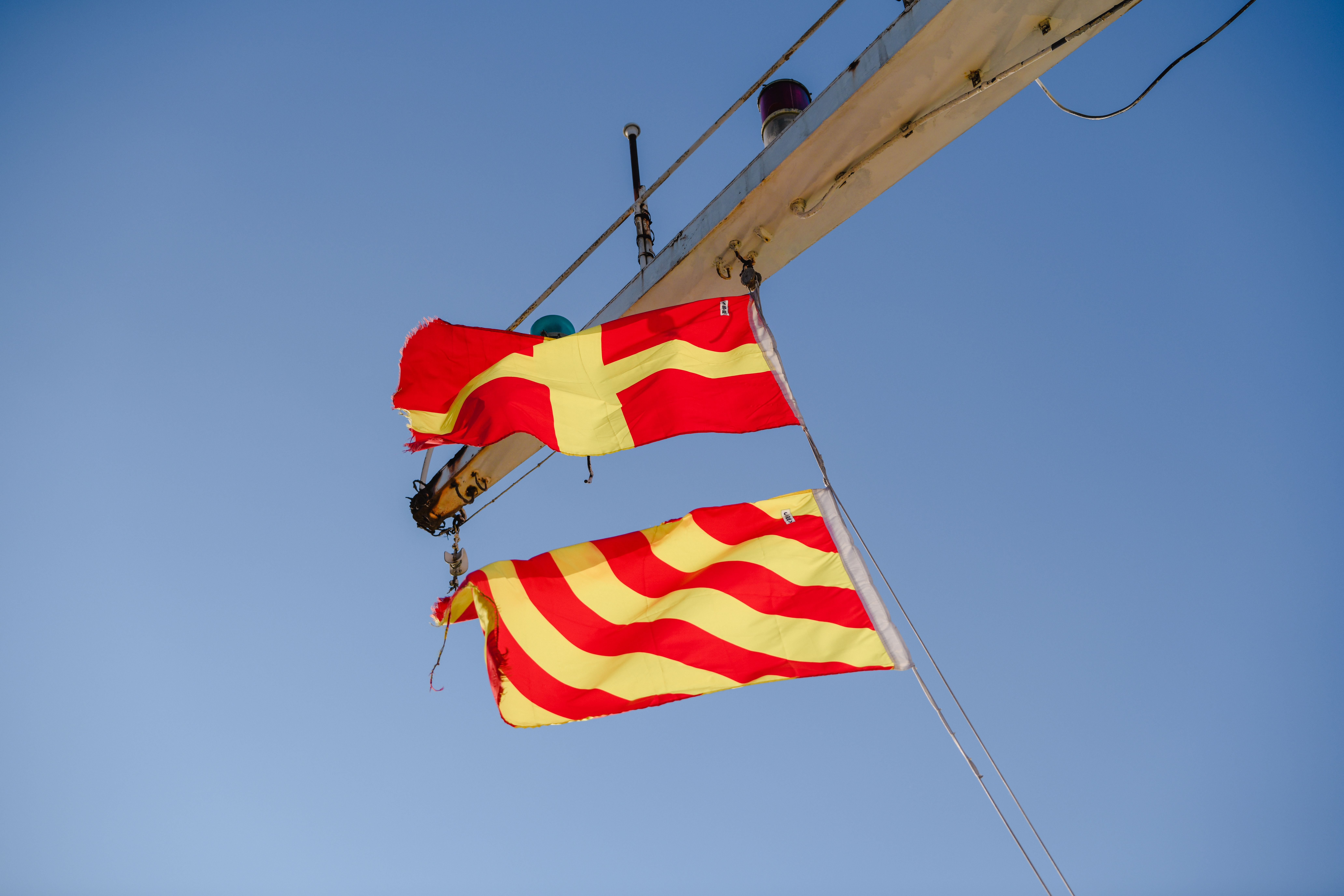 Red And Yellow Flags Photos, Download The BEST Free Red And Yellow ...