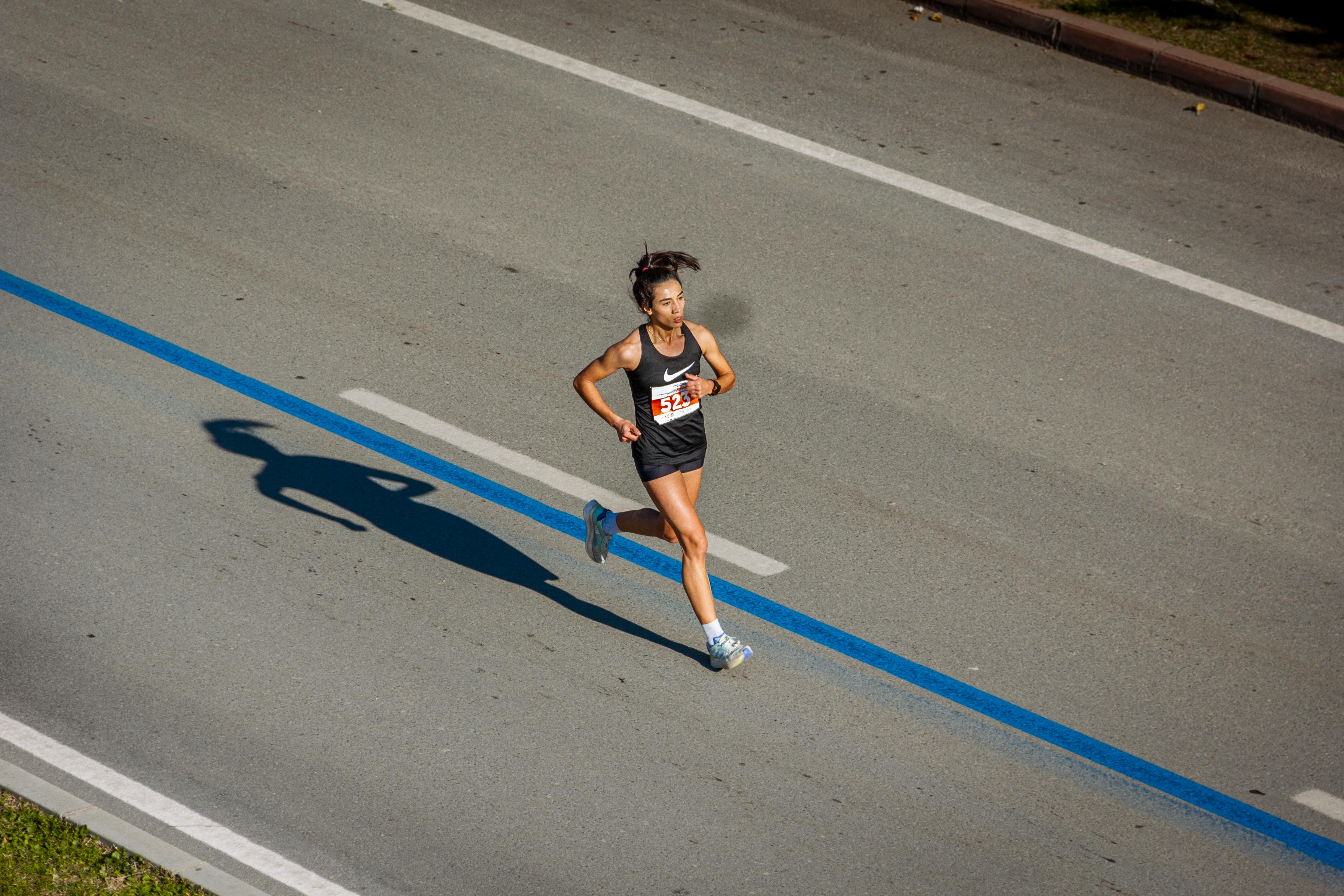 Woman Running Marathon · Free Stock Photo
