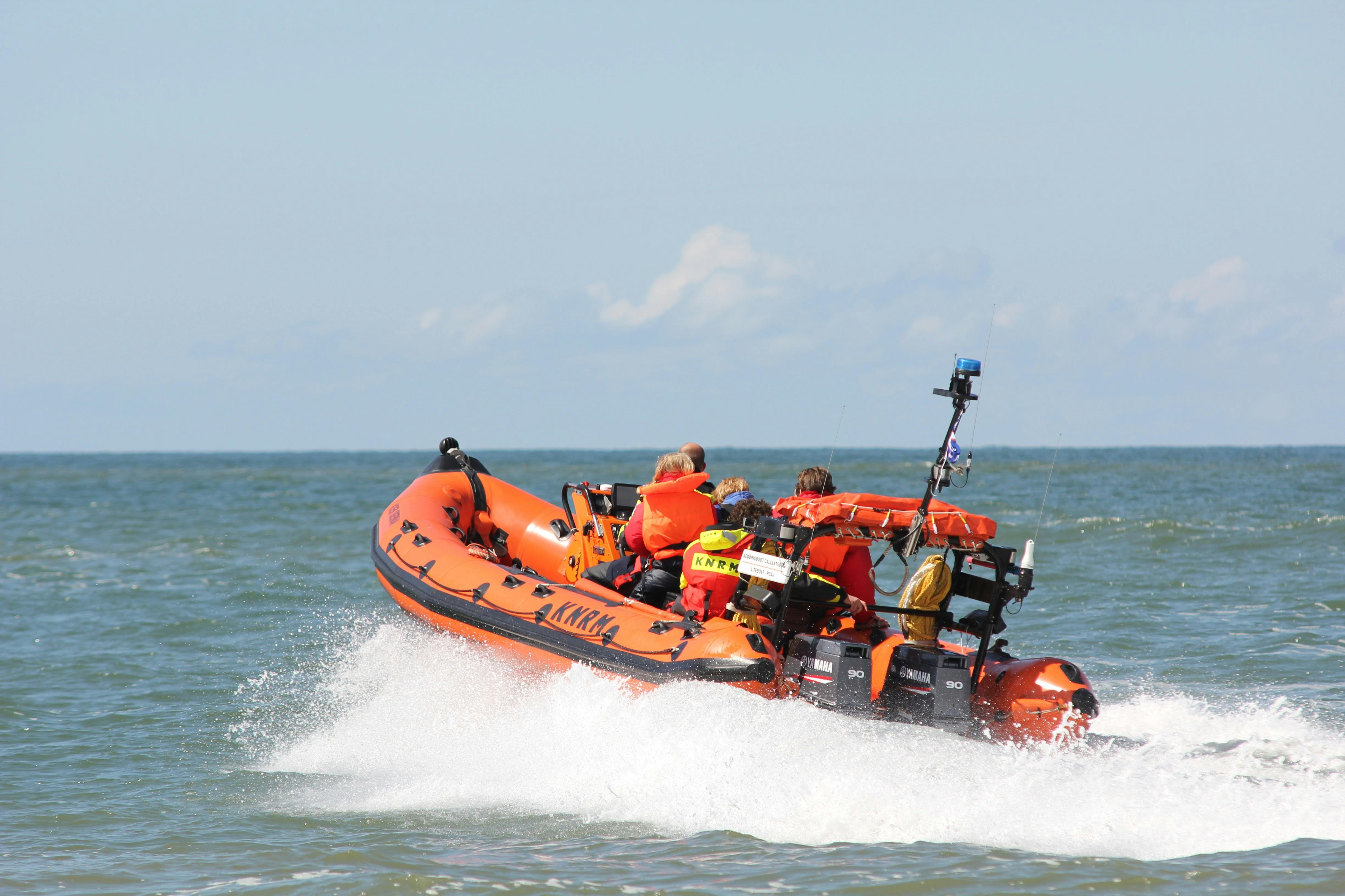 Rescue Squad on Pontoon Boat · Free Stock Photo