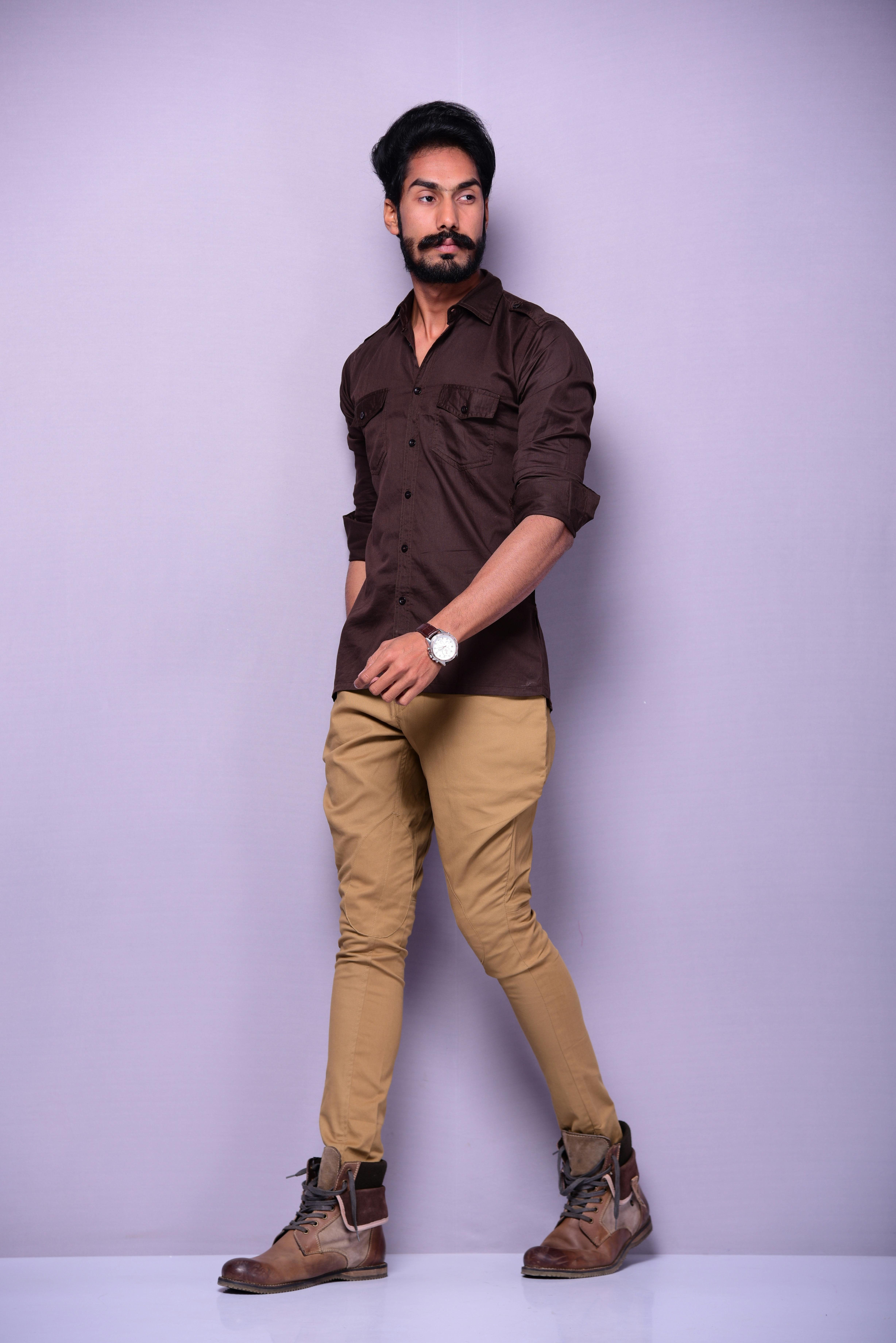 Man Posing with Tripod · Free Stock Photo