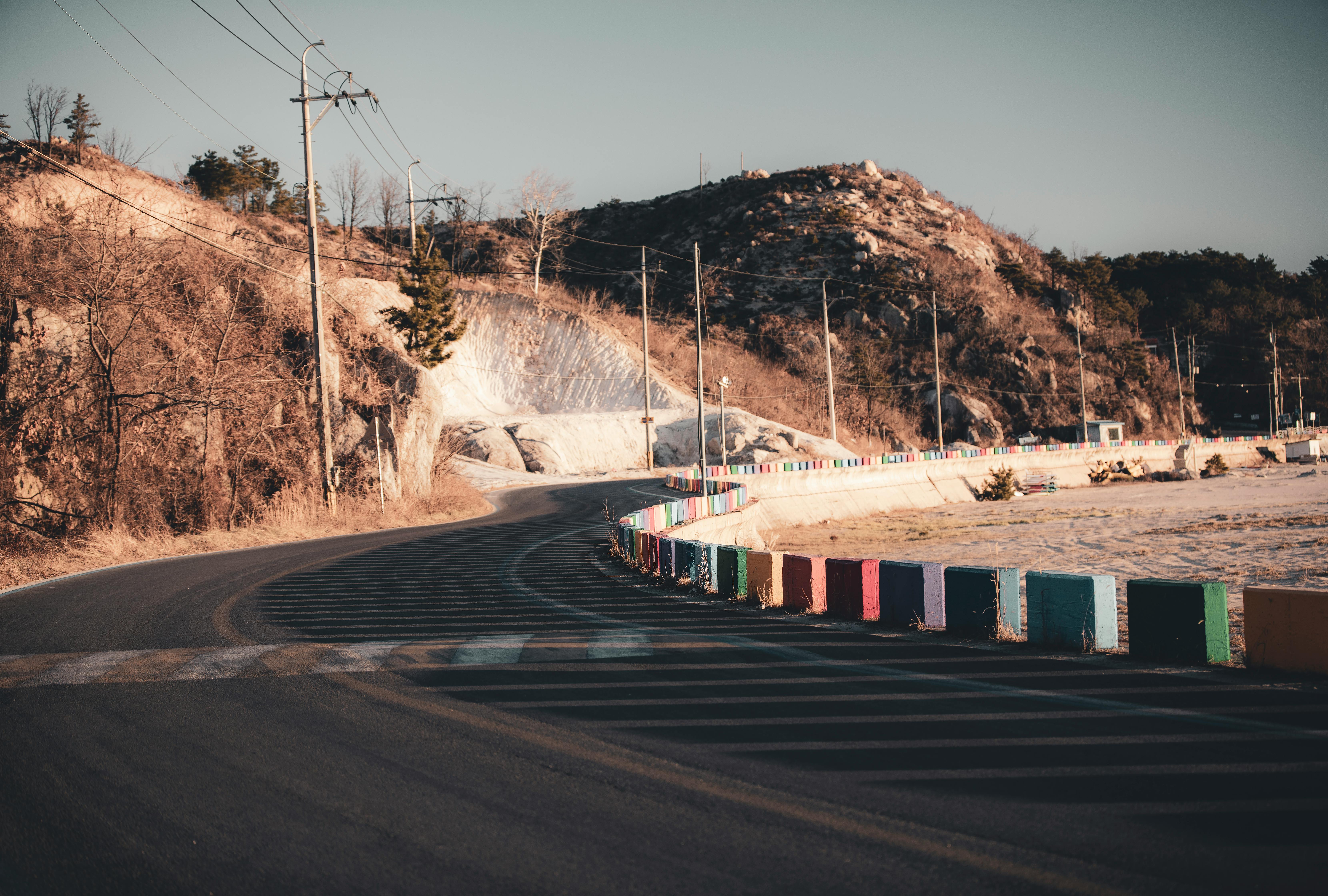 Colorful Concrete Barriers on Roadside · Free Stock Photo