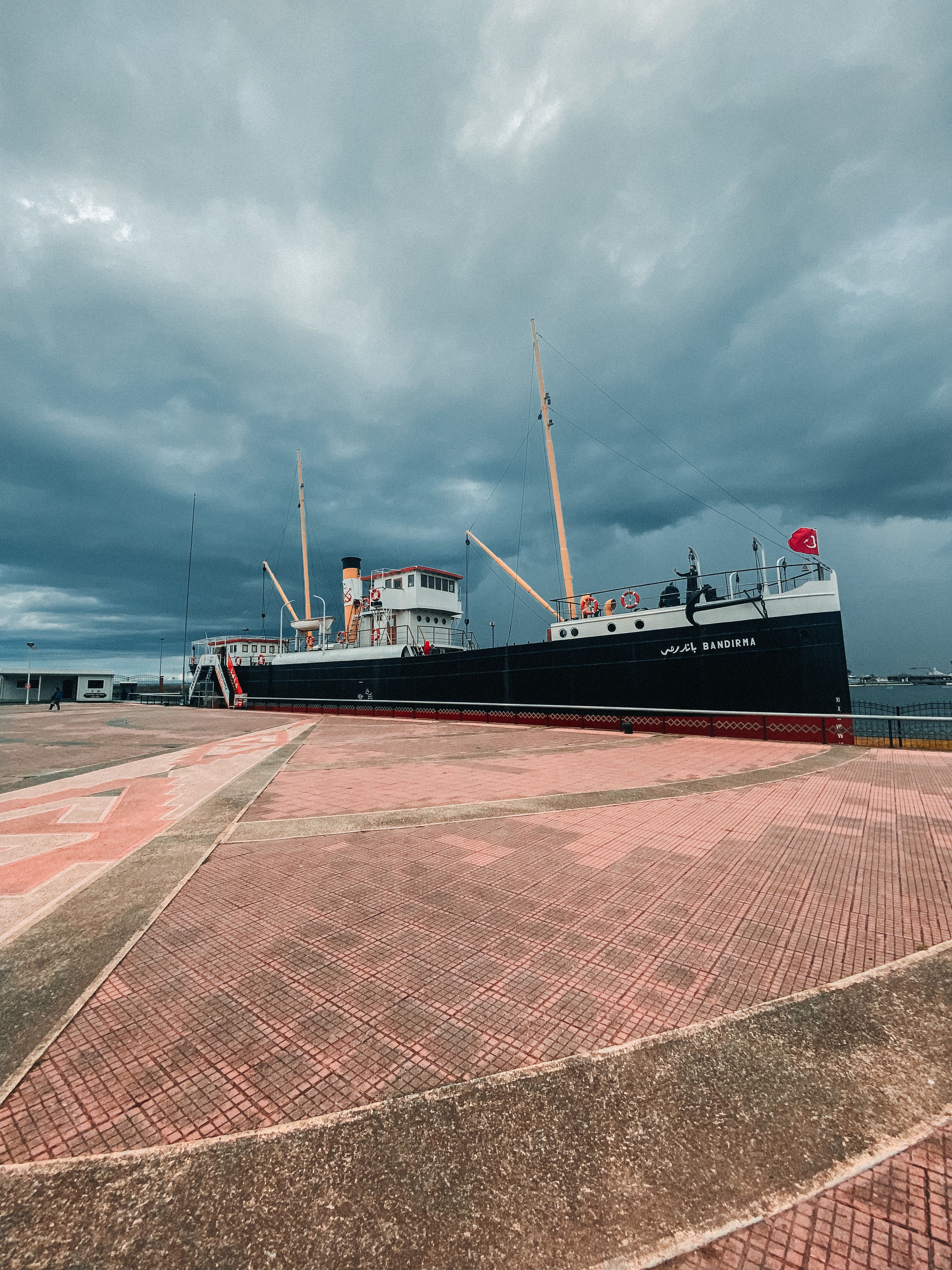 Military Vessel Moored on Shore · Free Stock Photo