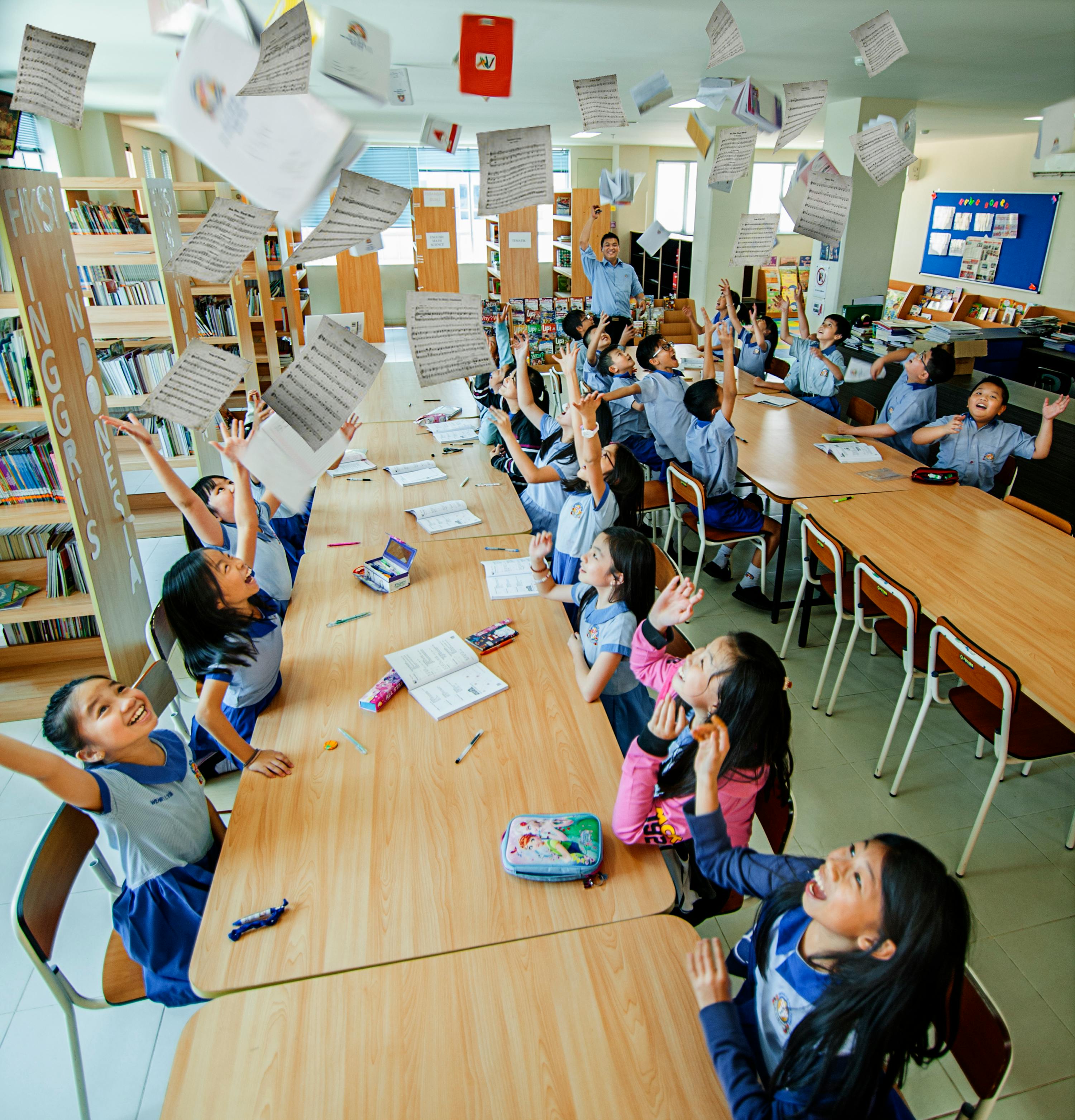 Boy Standing Inside a Classroom · Free Stock Photo