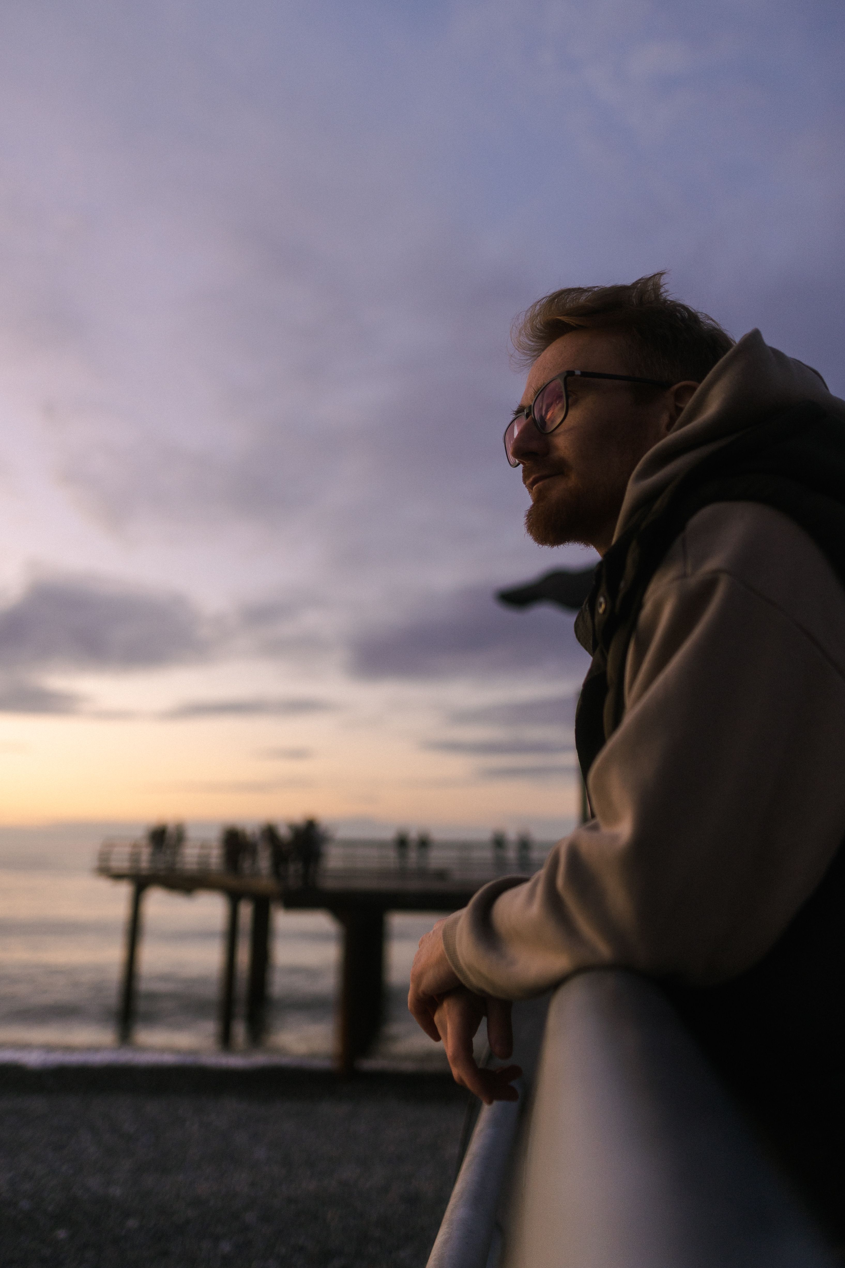 Man Leaning on a Handrail · Free Stock Photo