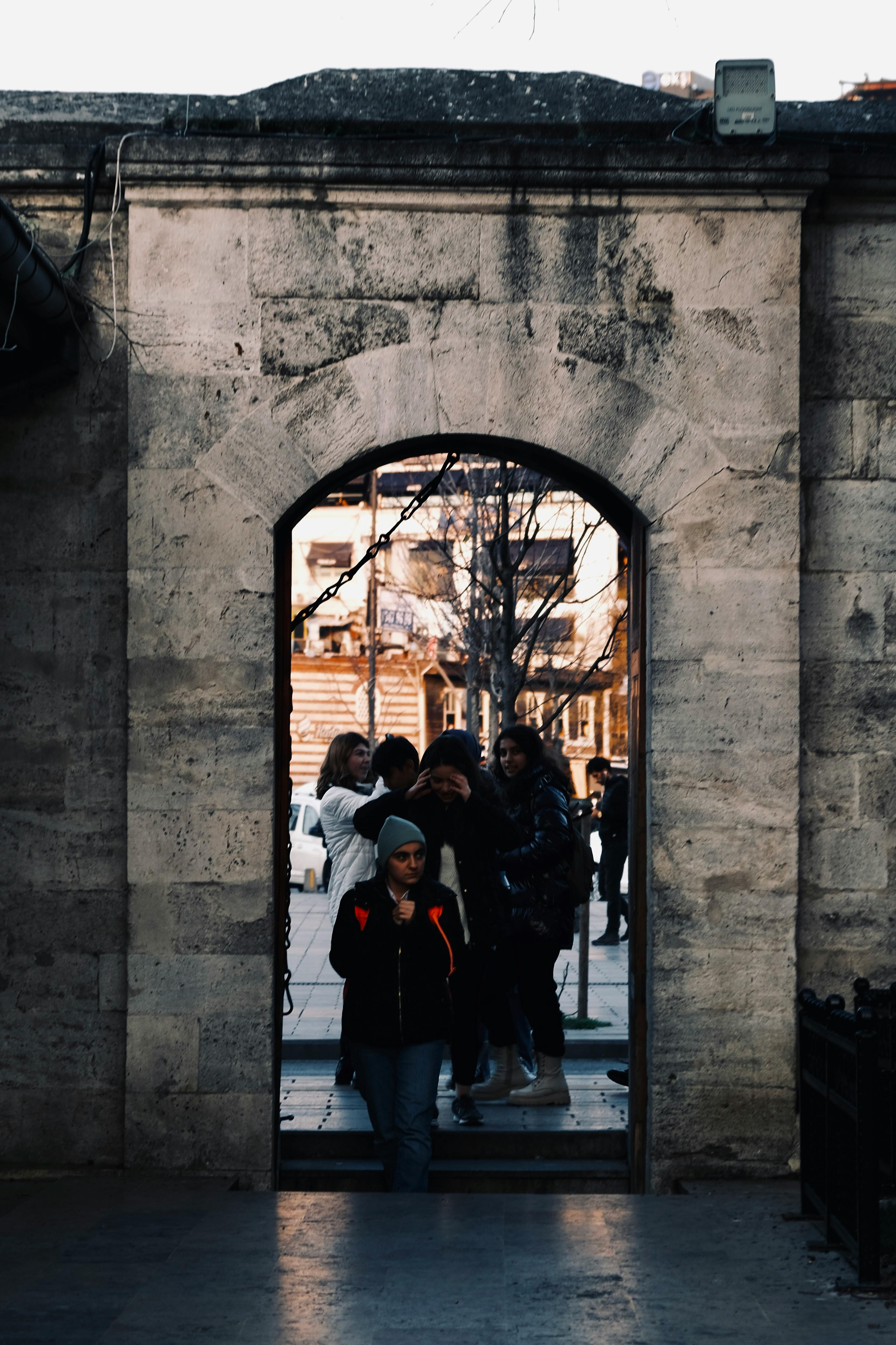 Man Standing Under Arch · Free Stock Photo