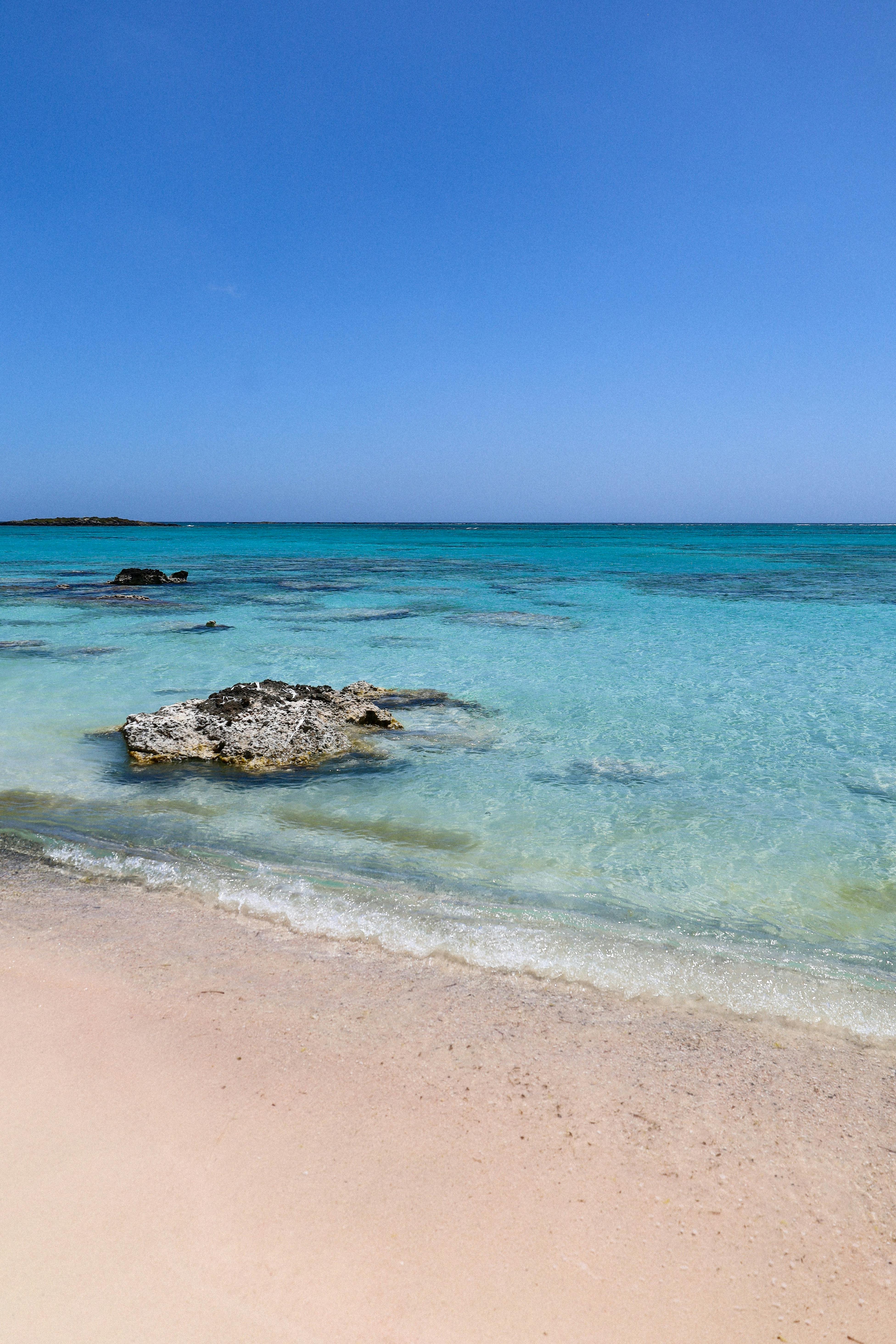 A Clear Water on the Beach Under the Blue Sky · Free Stock Photo