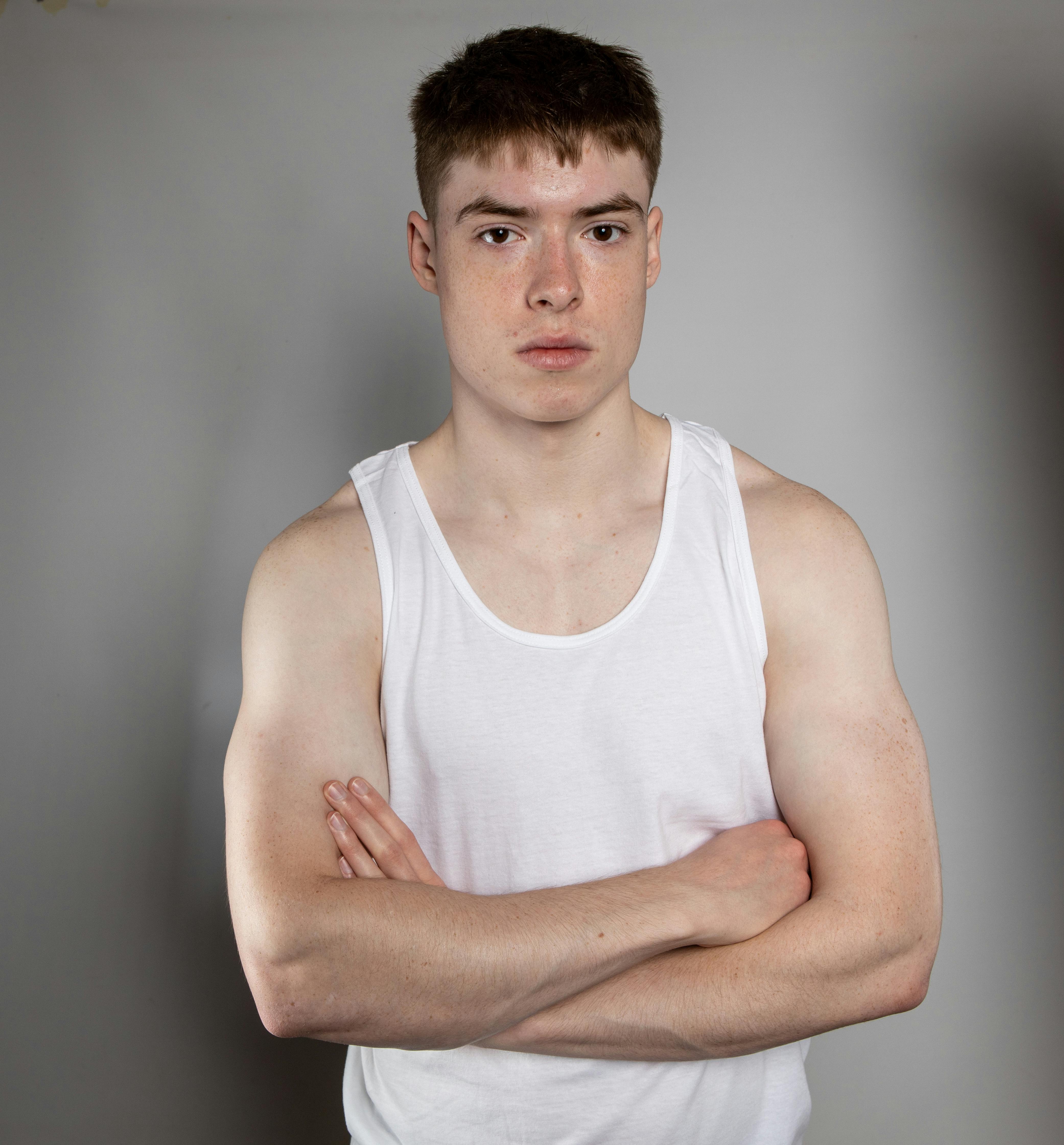 A Man Wearing White Tank Top · Free Stock Photo