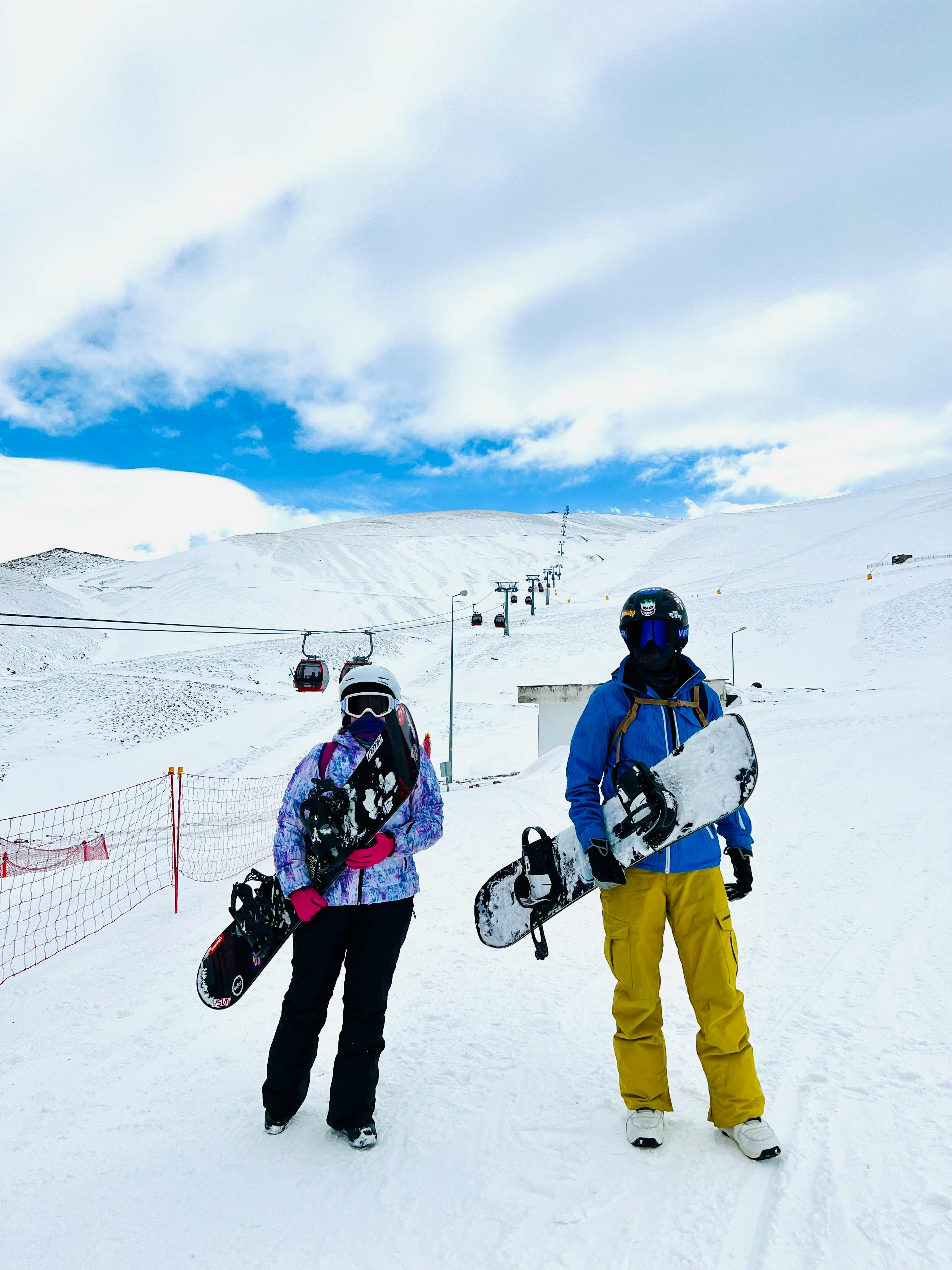 Woman Snowboarding on a Slope · Free Stock Photo