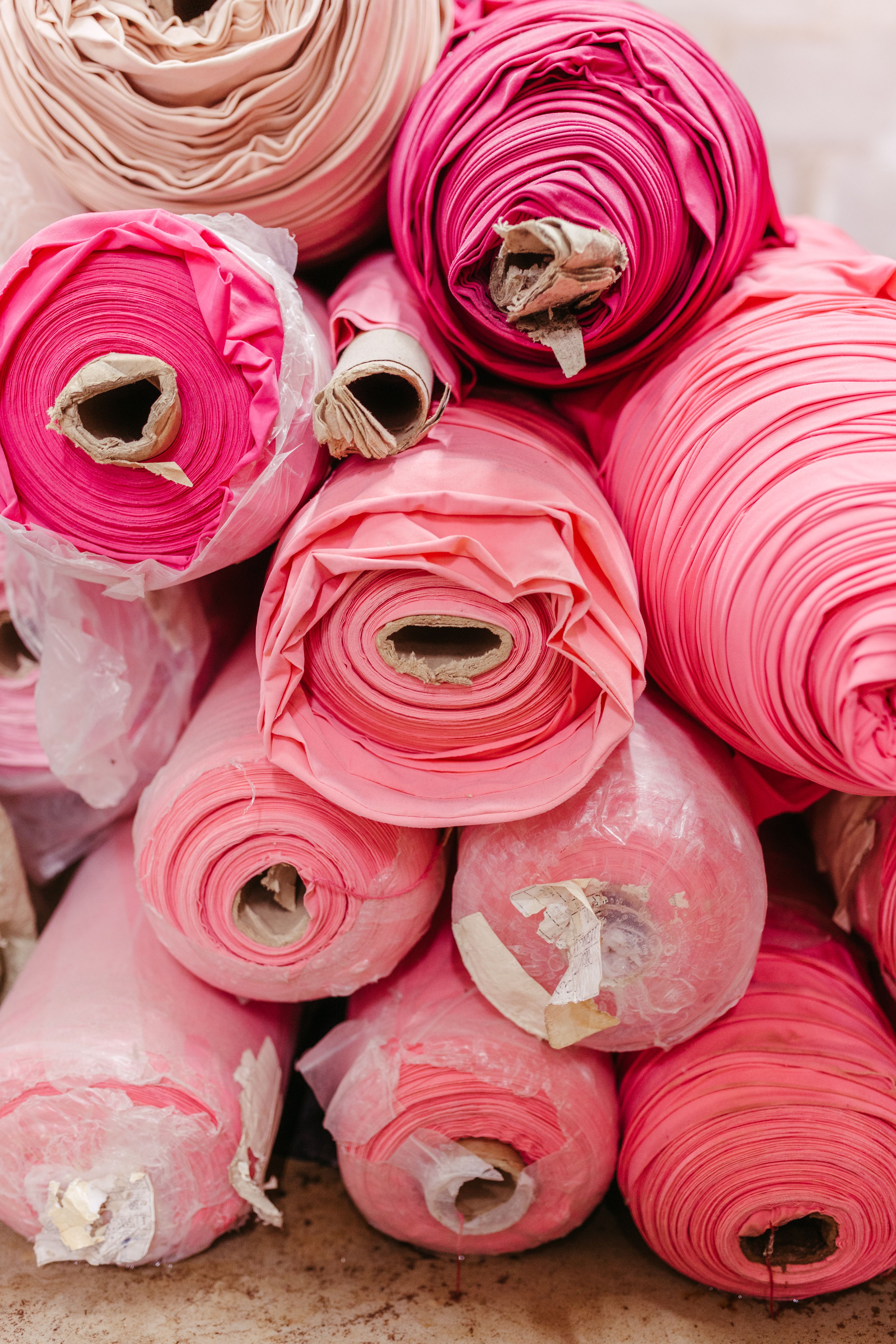 Stacked Rolls of Pink Fabric · Free Stock Photo