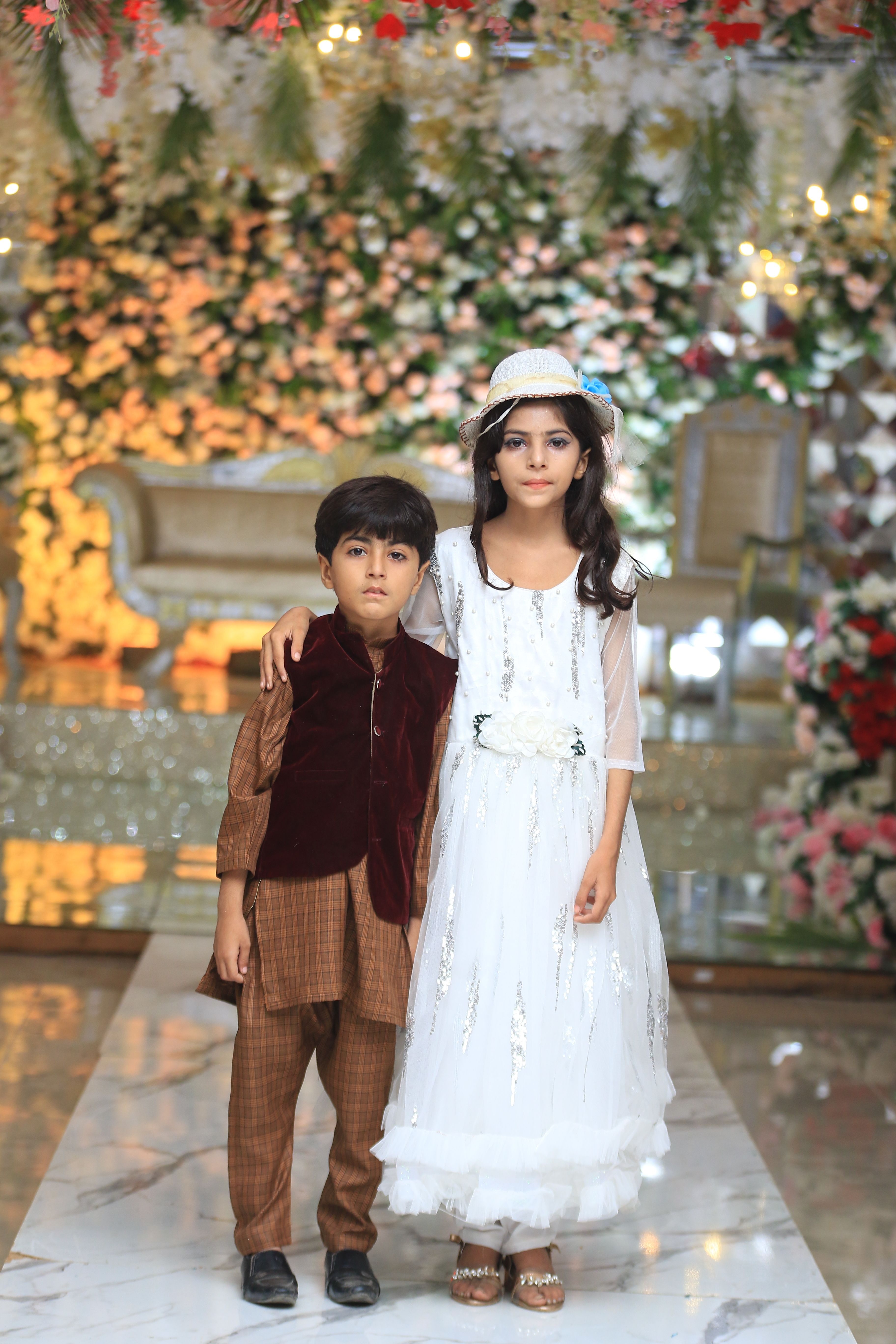 Girl and Boy Posing Together at Wedding · Free Stock Photo