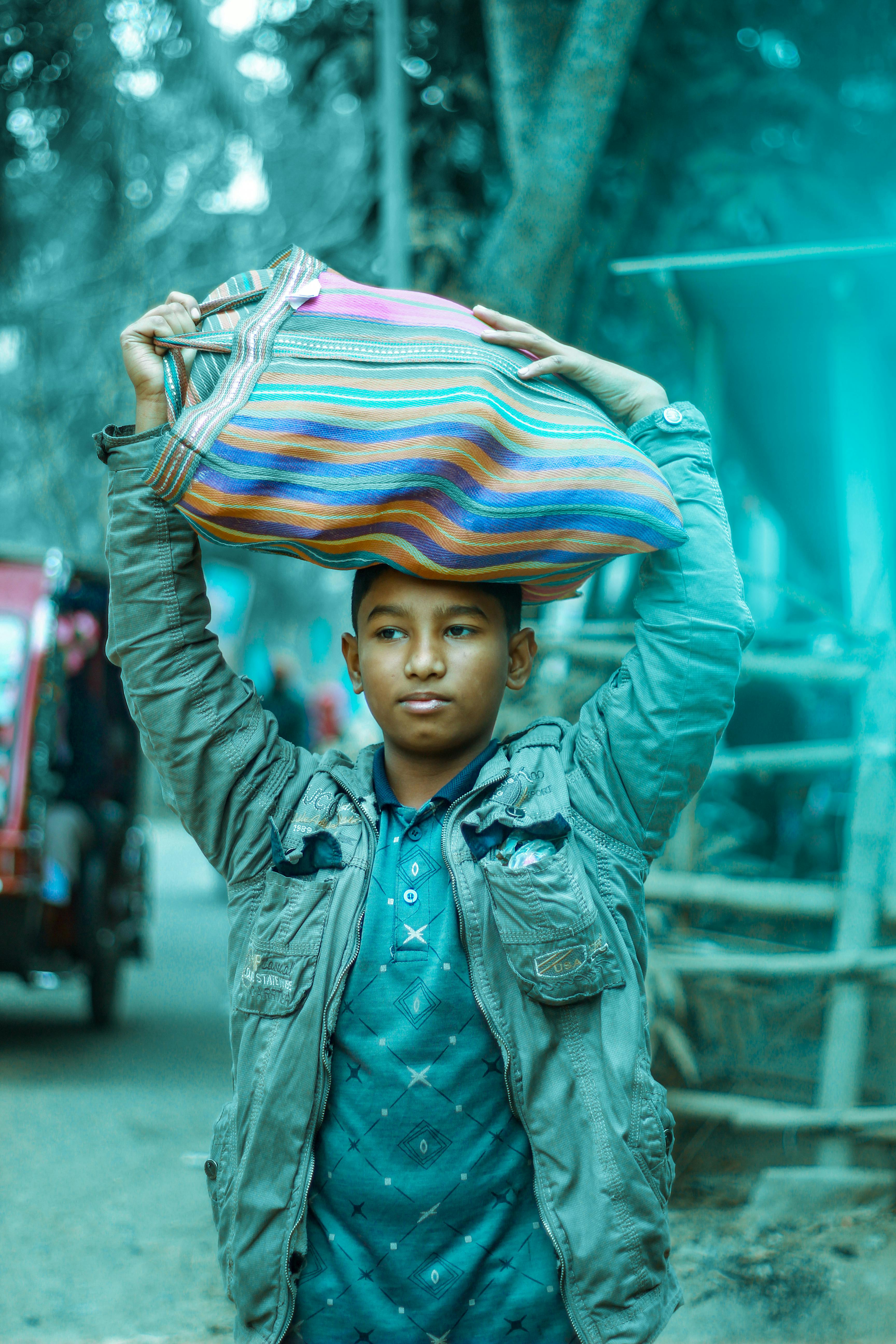 Boy Holding Bag on Head · Free Stock Photo