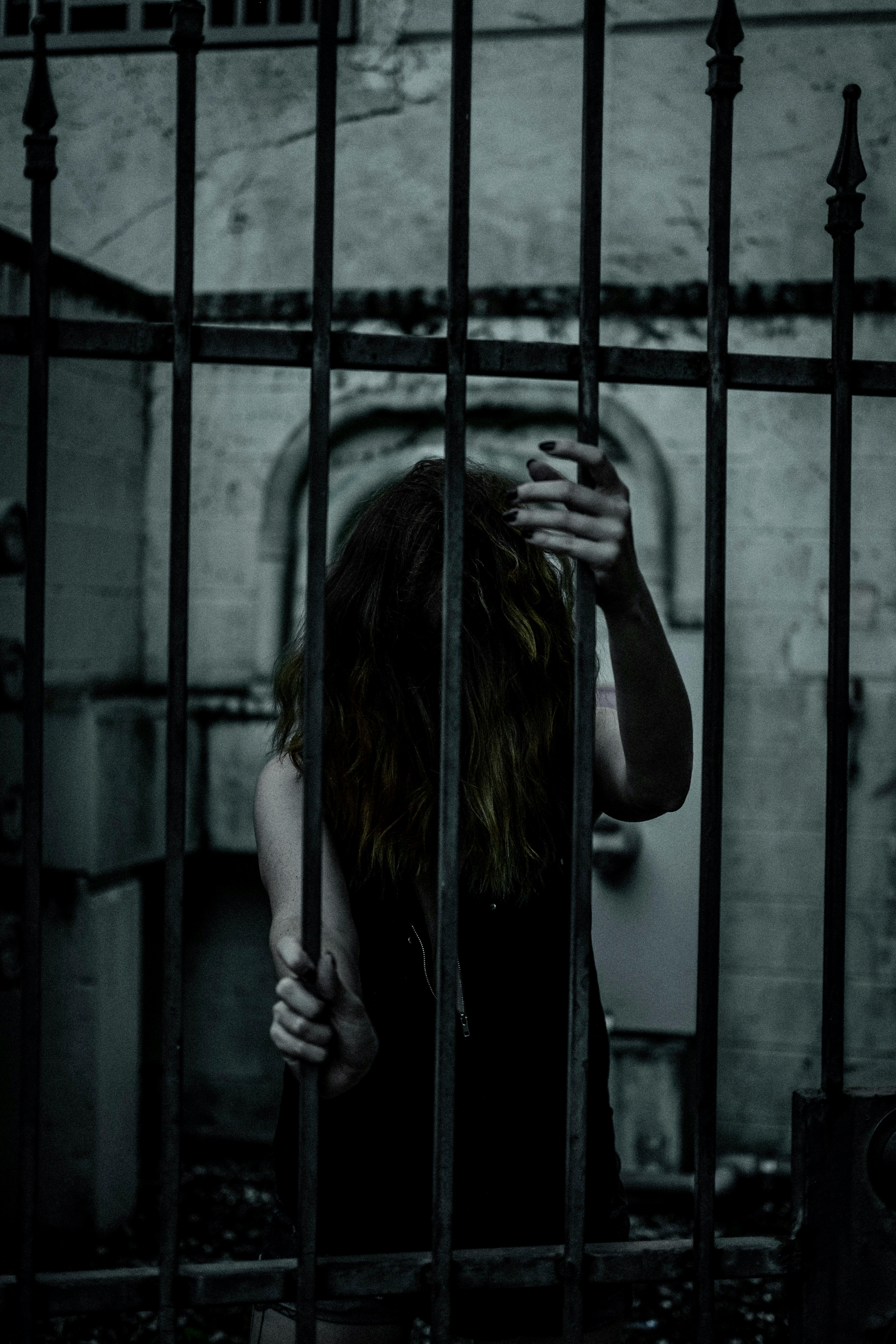 Woman Behind Gate · Free Stock Photo