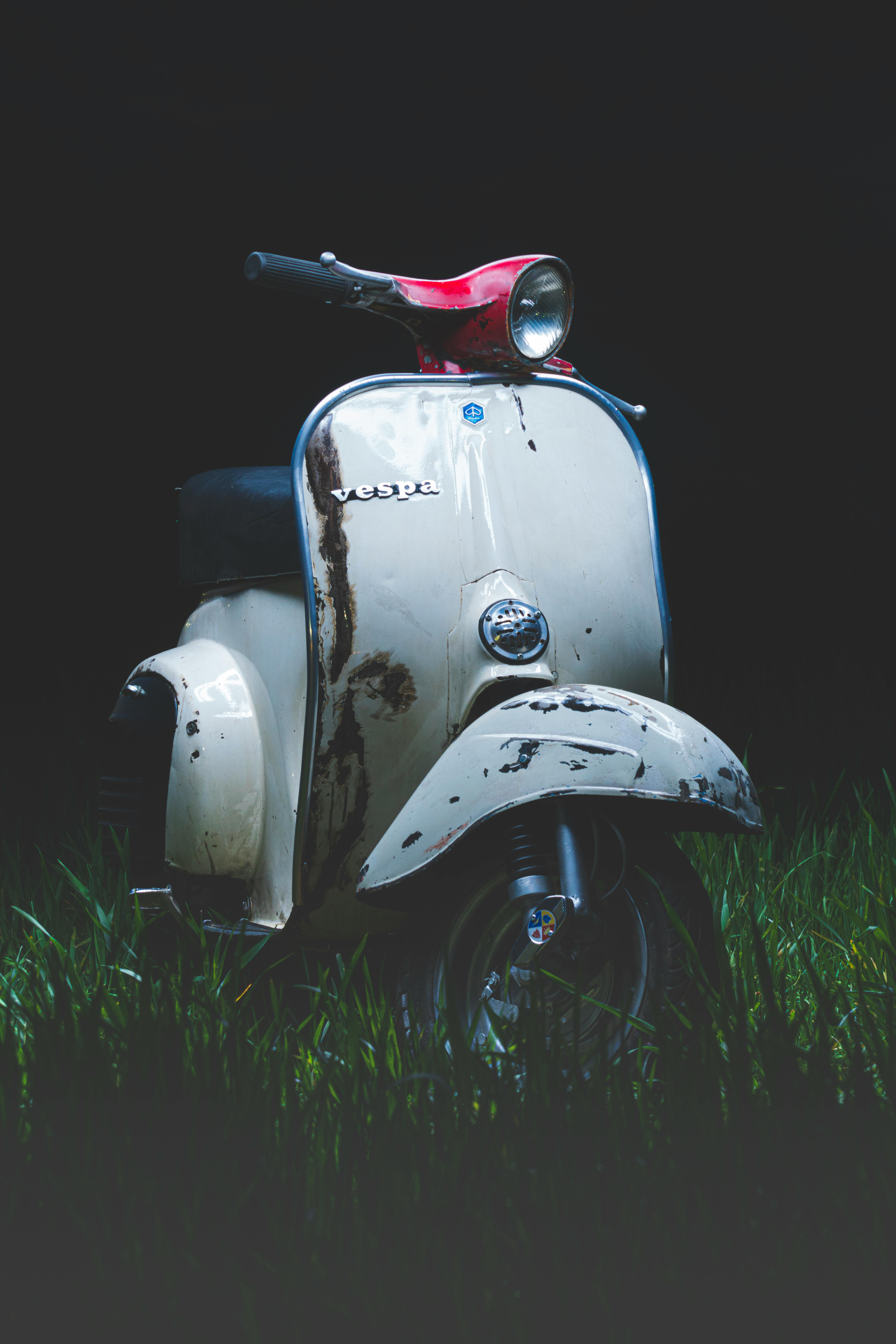 Rusty Vespa Parked on Grass Field · Free Stock Photo