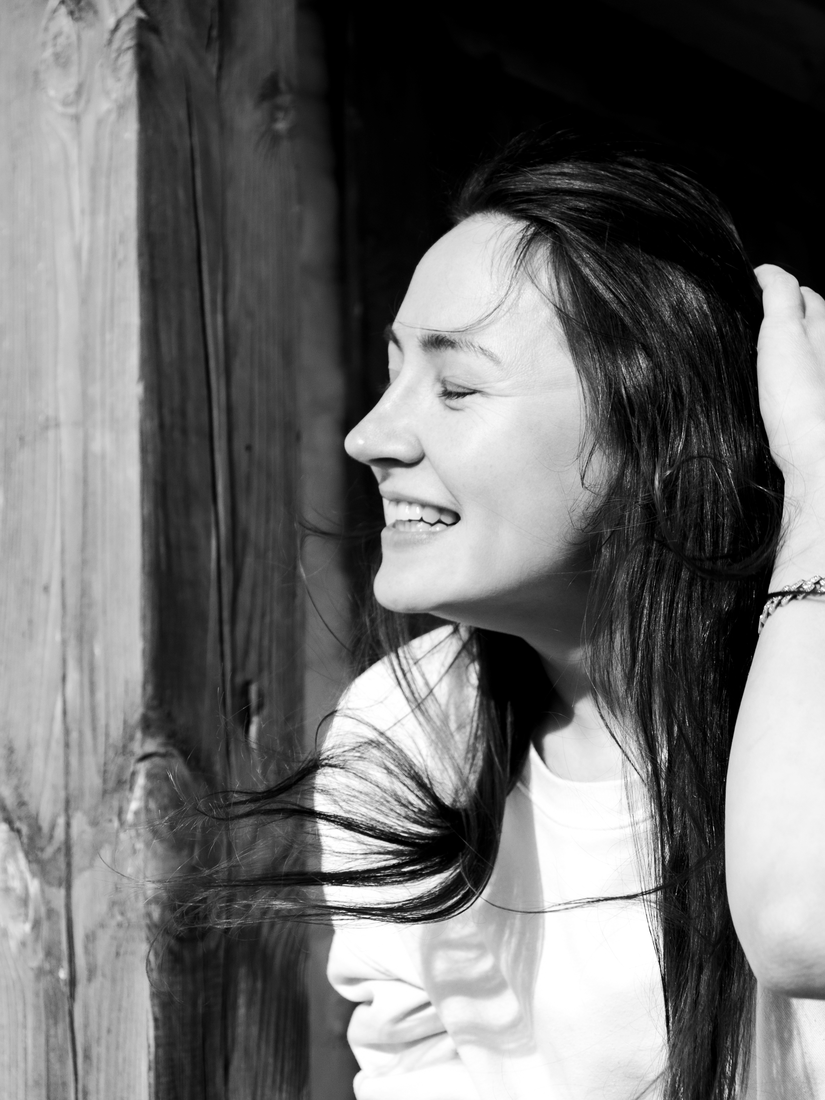 Grayscale Portrait of a Woman Smiling · Free Stock Photo
