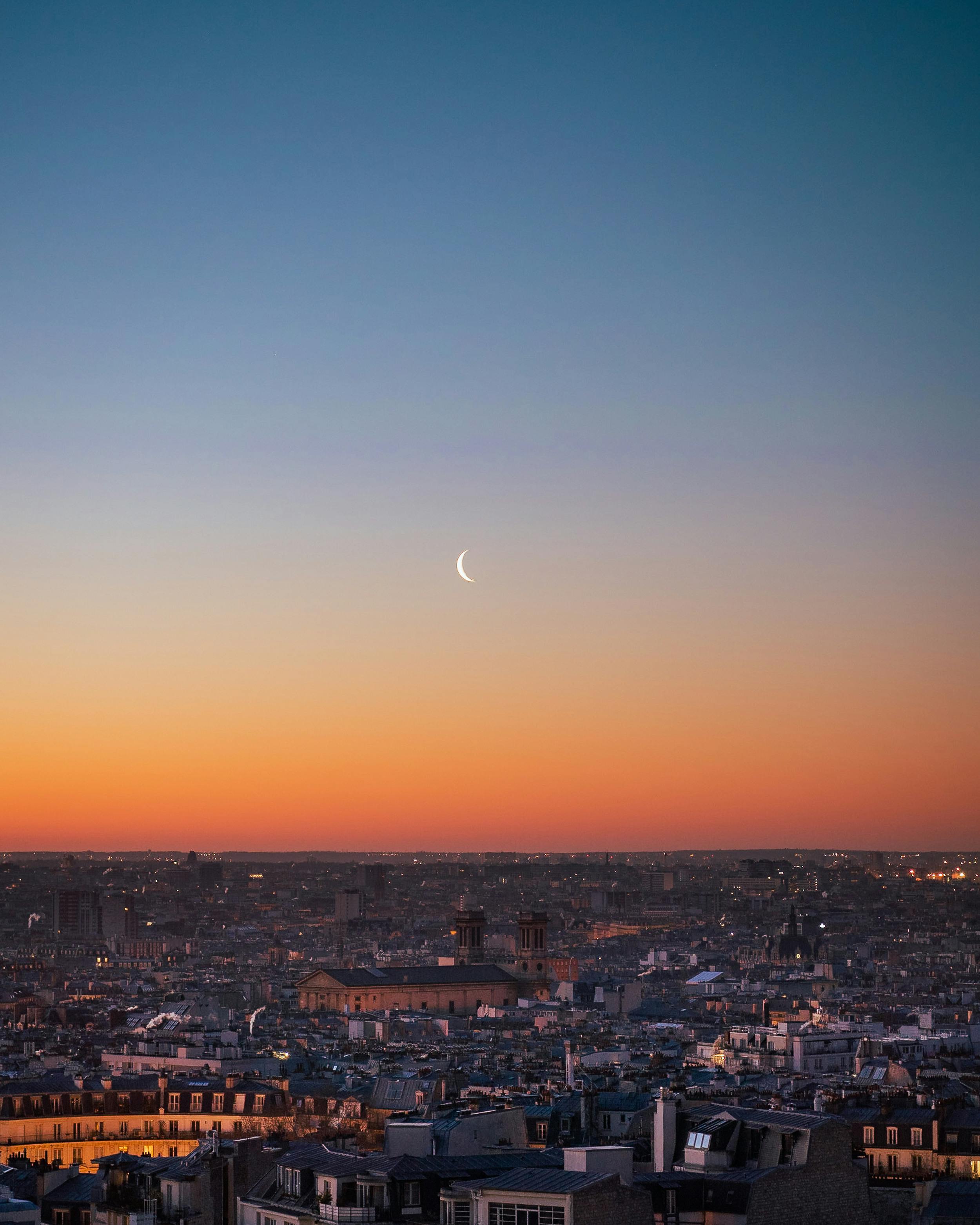 Moon in the Evening Sky over the City · Free Stock Photo