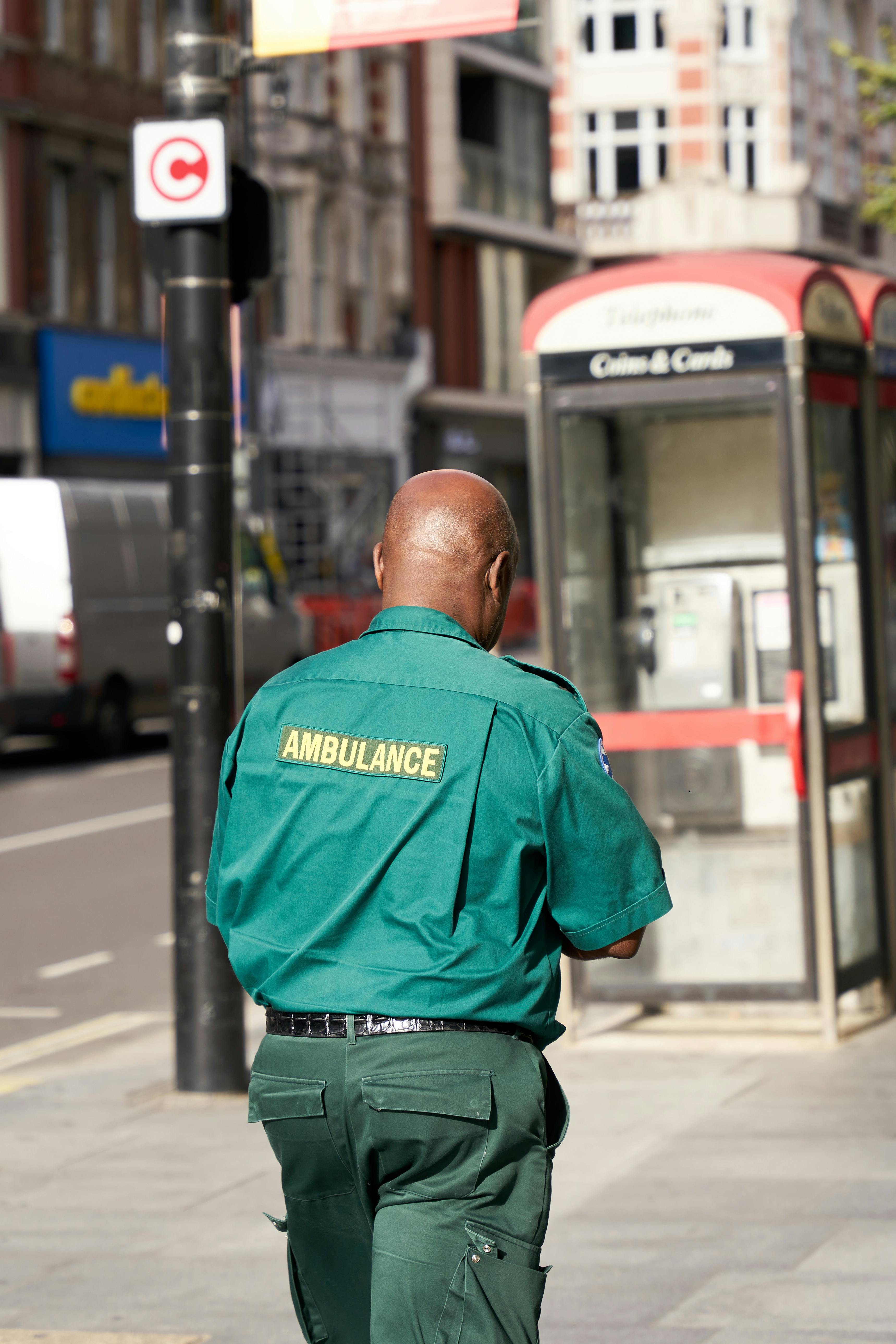 Paramedic on Sidewalk in City · Free Stock Photo