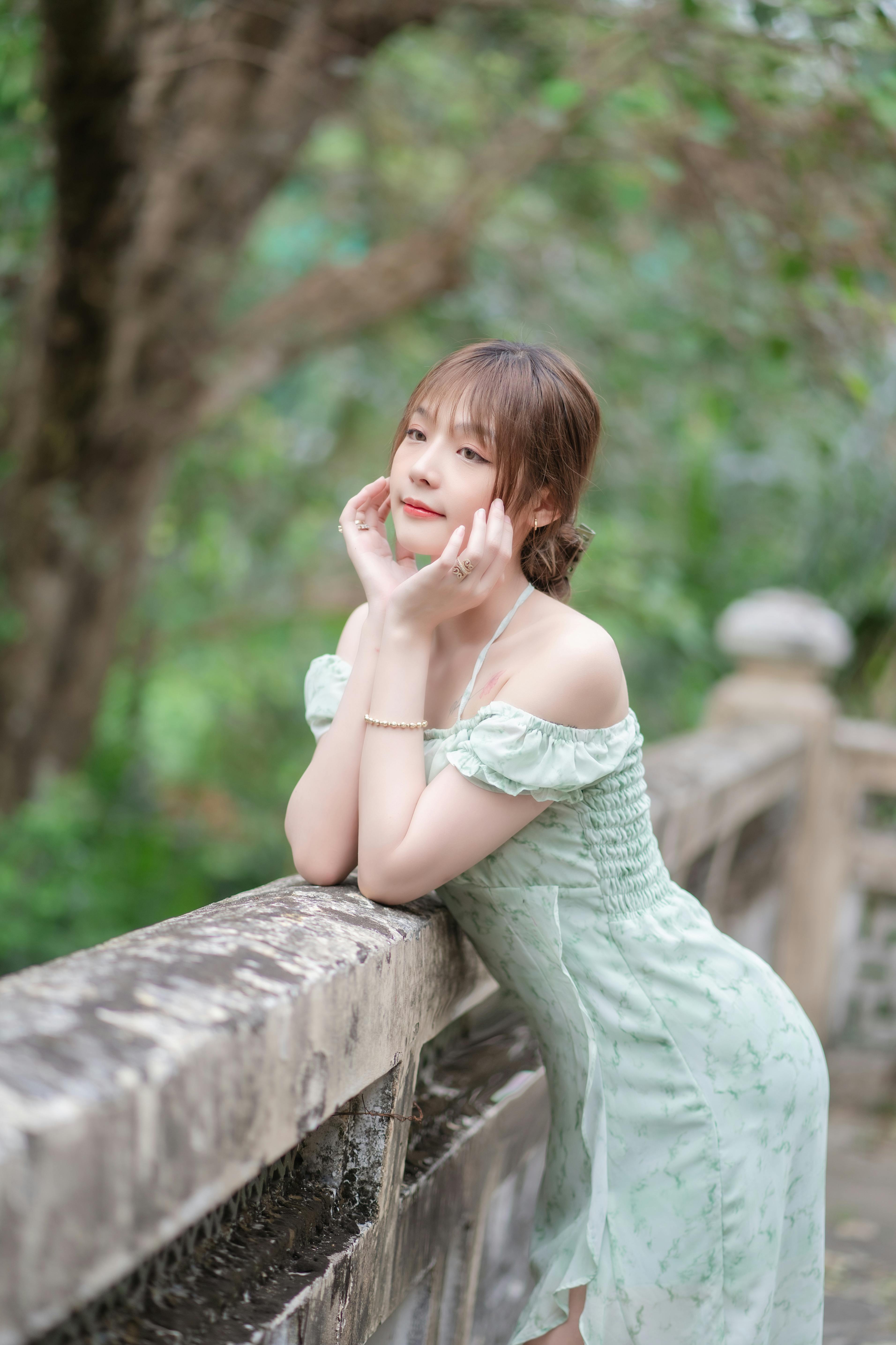 Beautiful Girl in Off Shoulder Dress Leaning on Concrete Railing · Free ...
