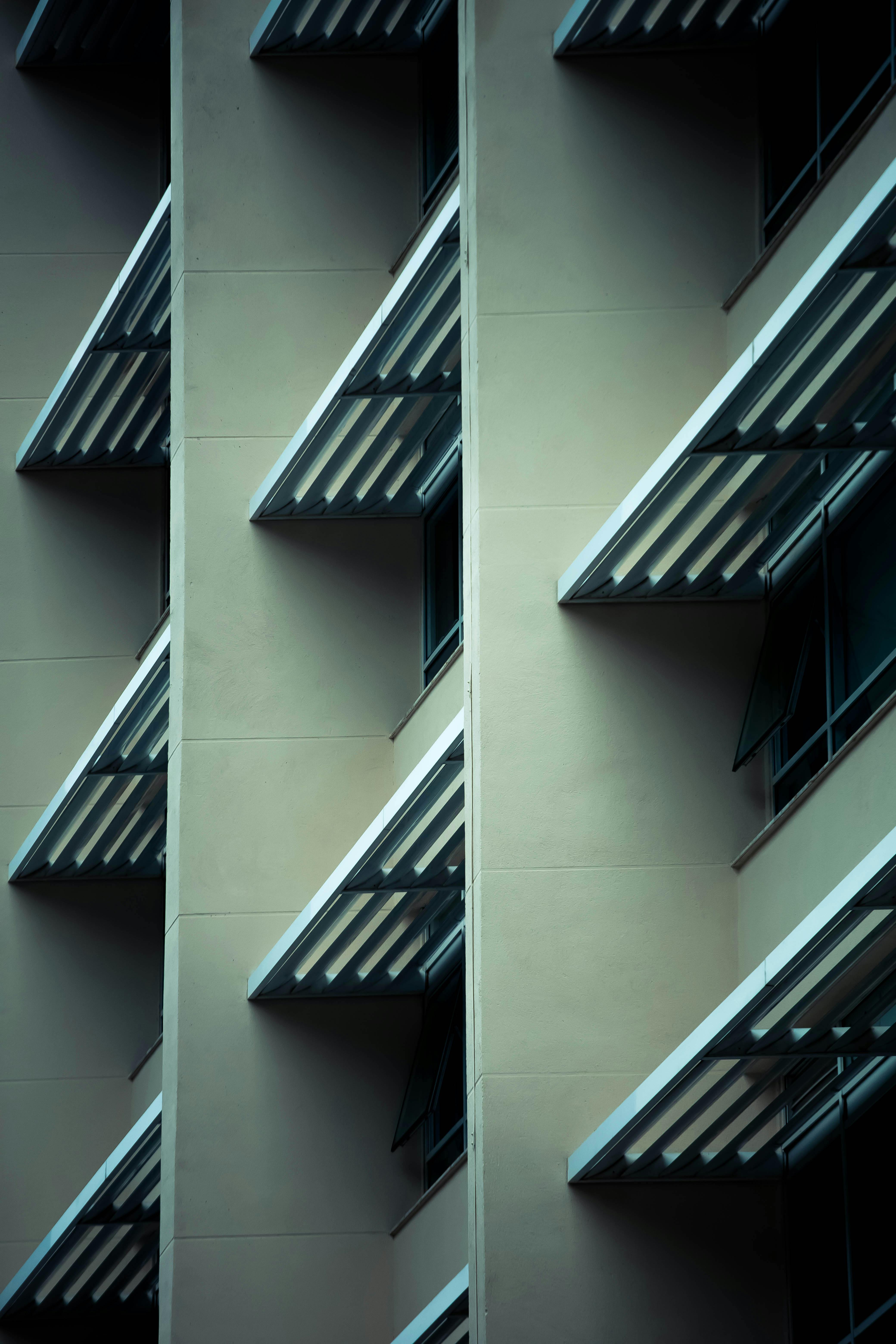 Shadows on Building Wall · Free Stock Photo