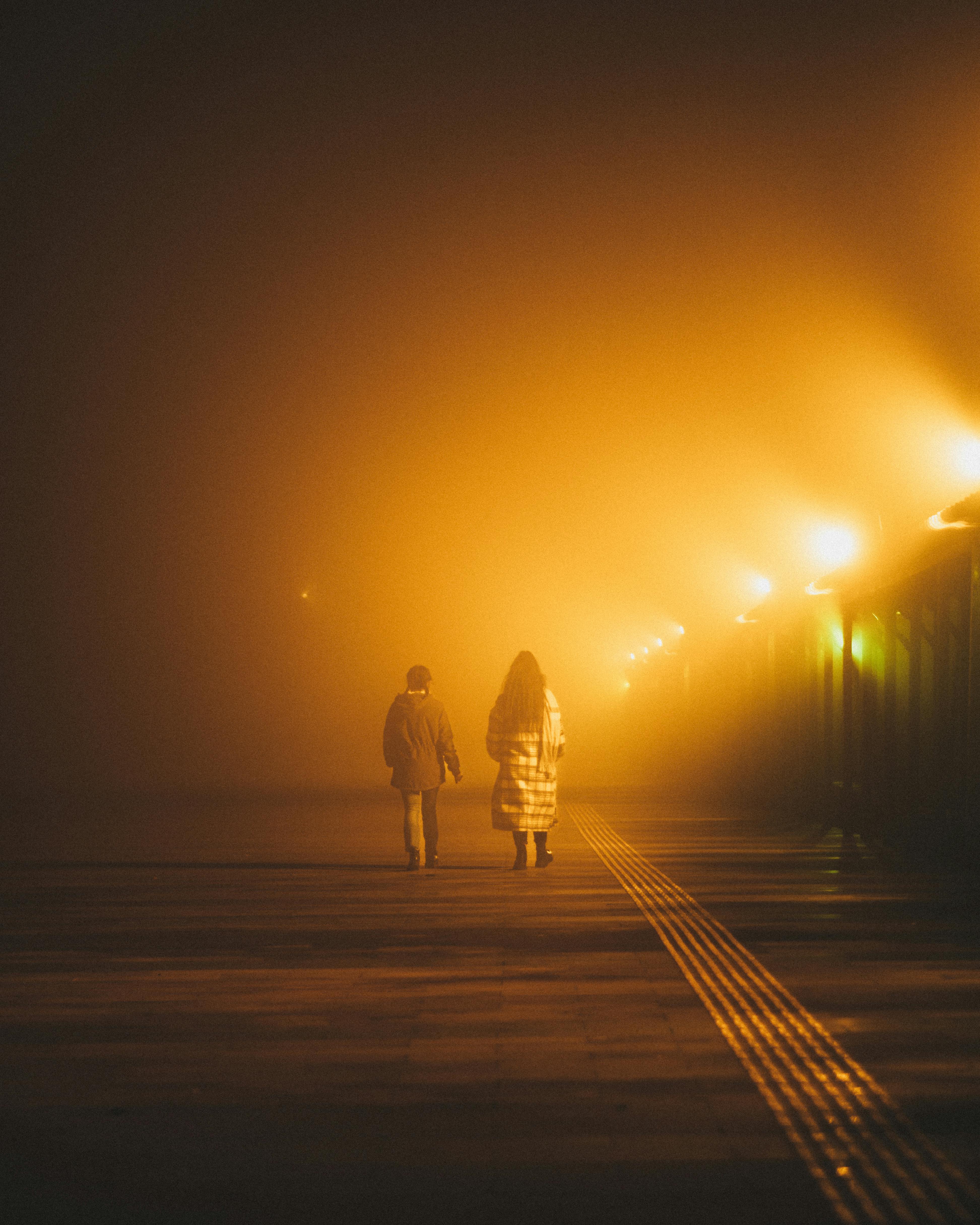 Person Walking on Street in Fog · Free Stock Photo