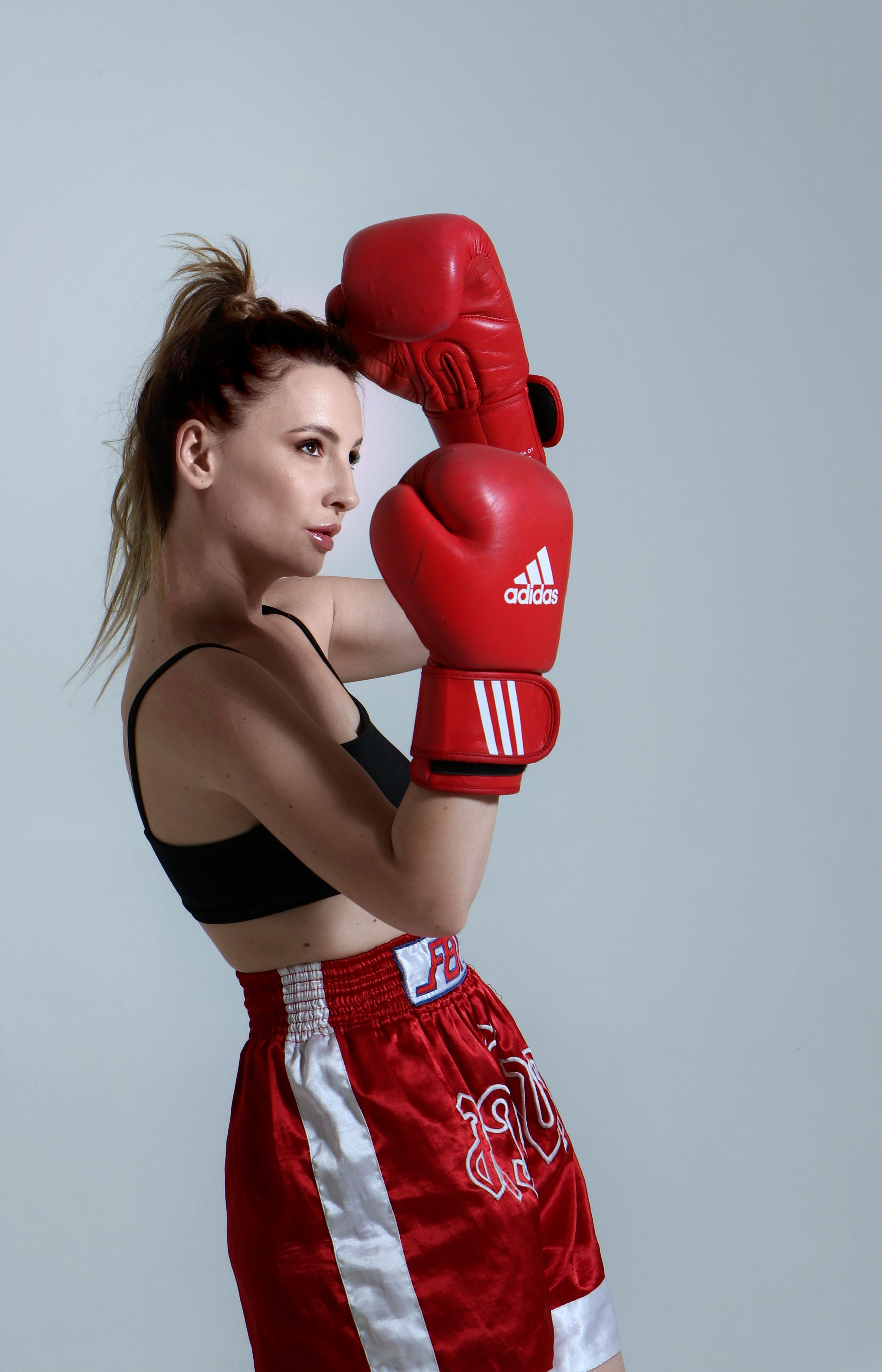 Portrait of a Woman with Boxing Gloves · Free Stock Photo