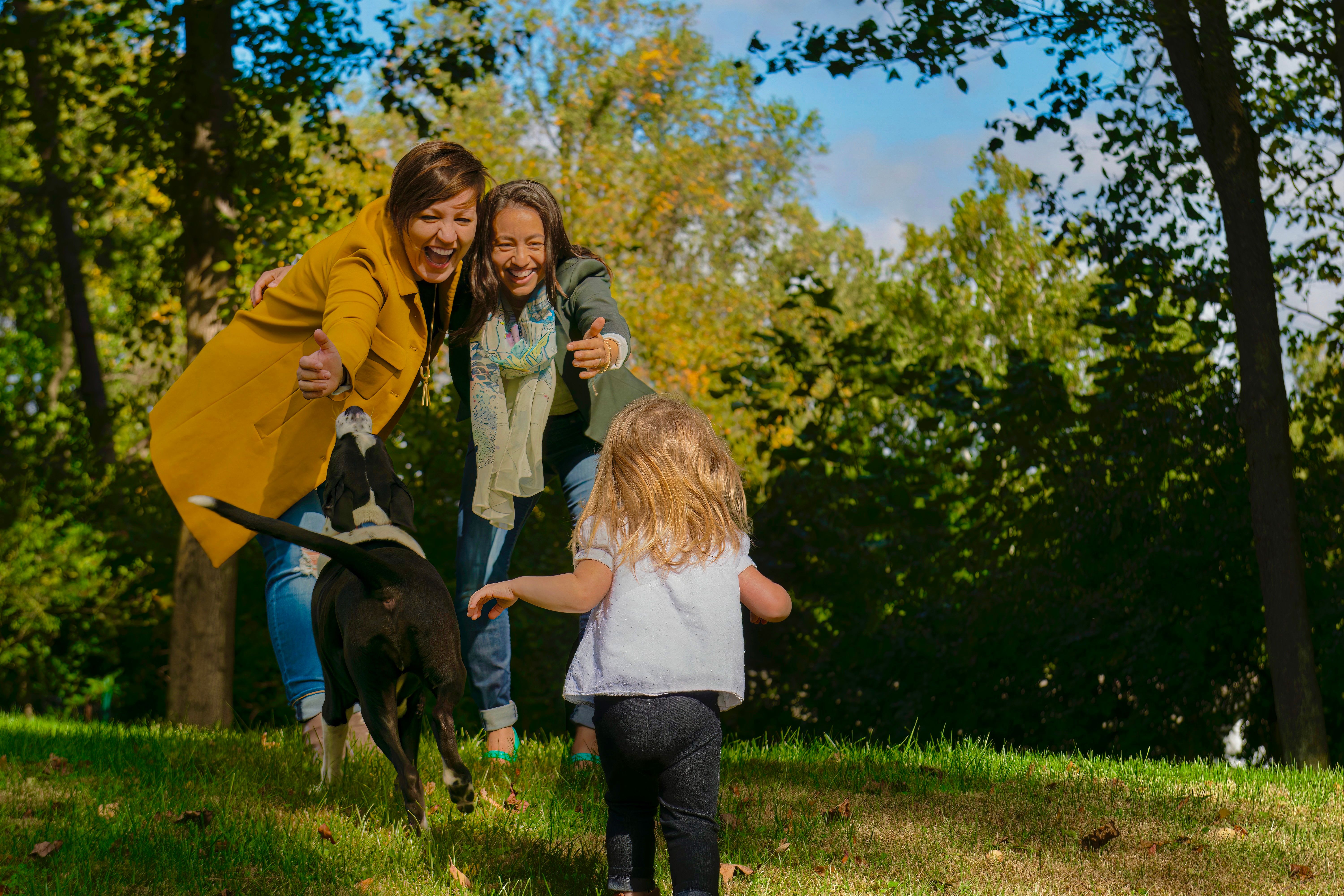 Girl Running Towards Her Parents in the Park · Free Stock Photo