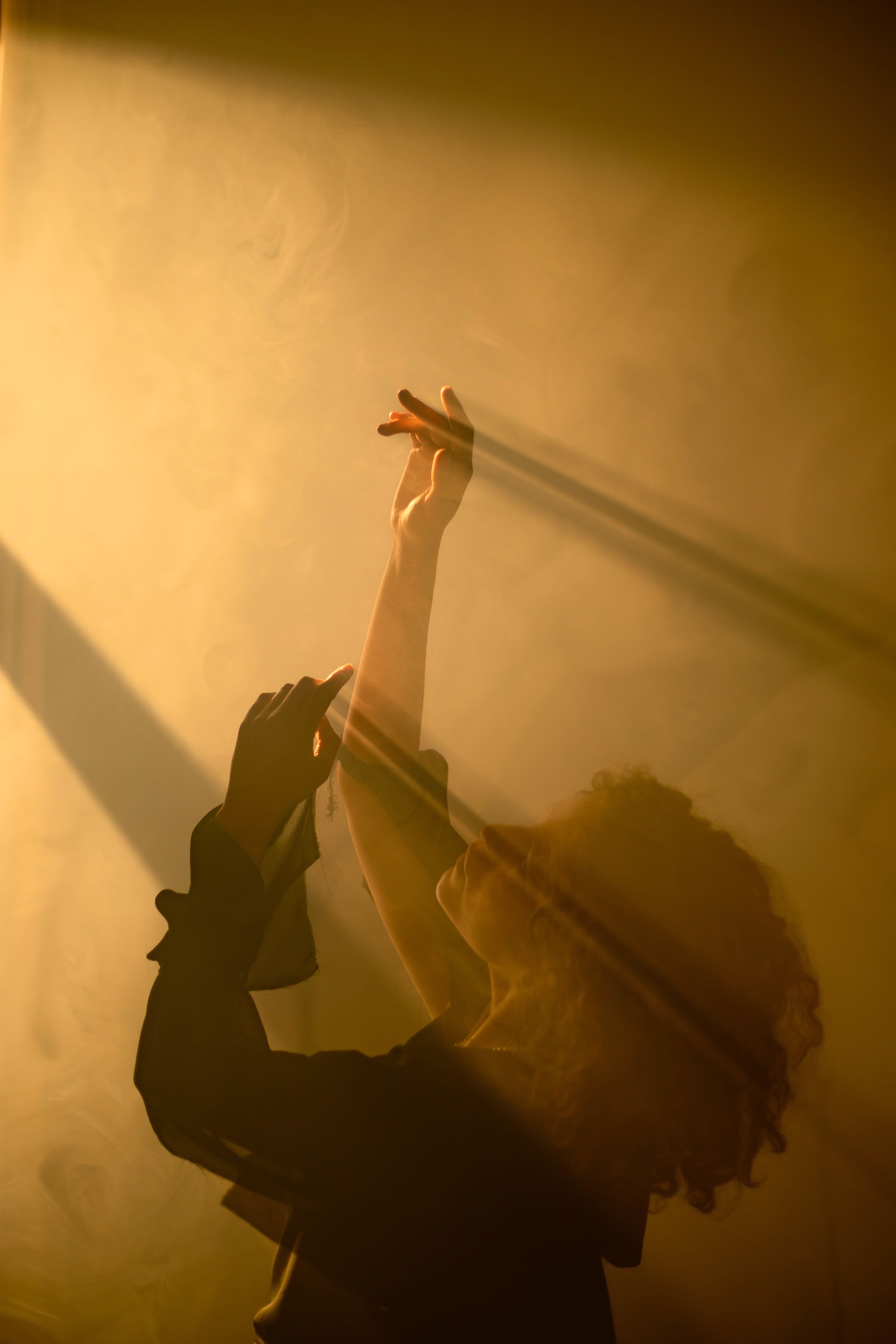 Silhouette of Woman Dancing in Light · Free Stock Photo
