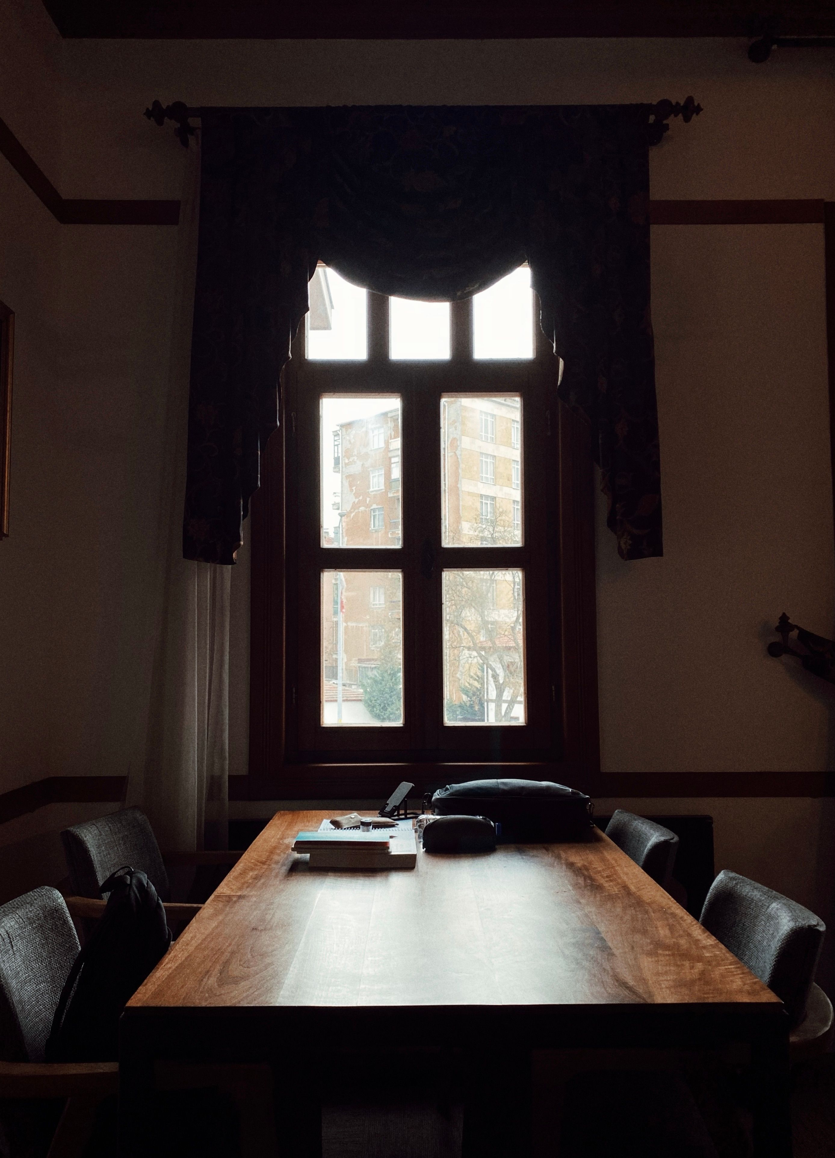 A Wooden Table beside a Window · Free Stock Photo