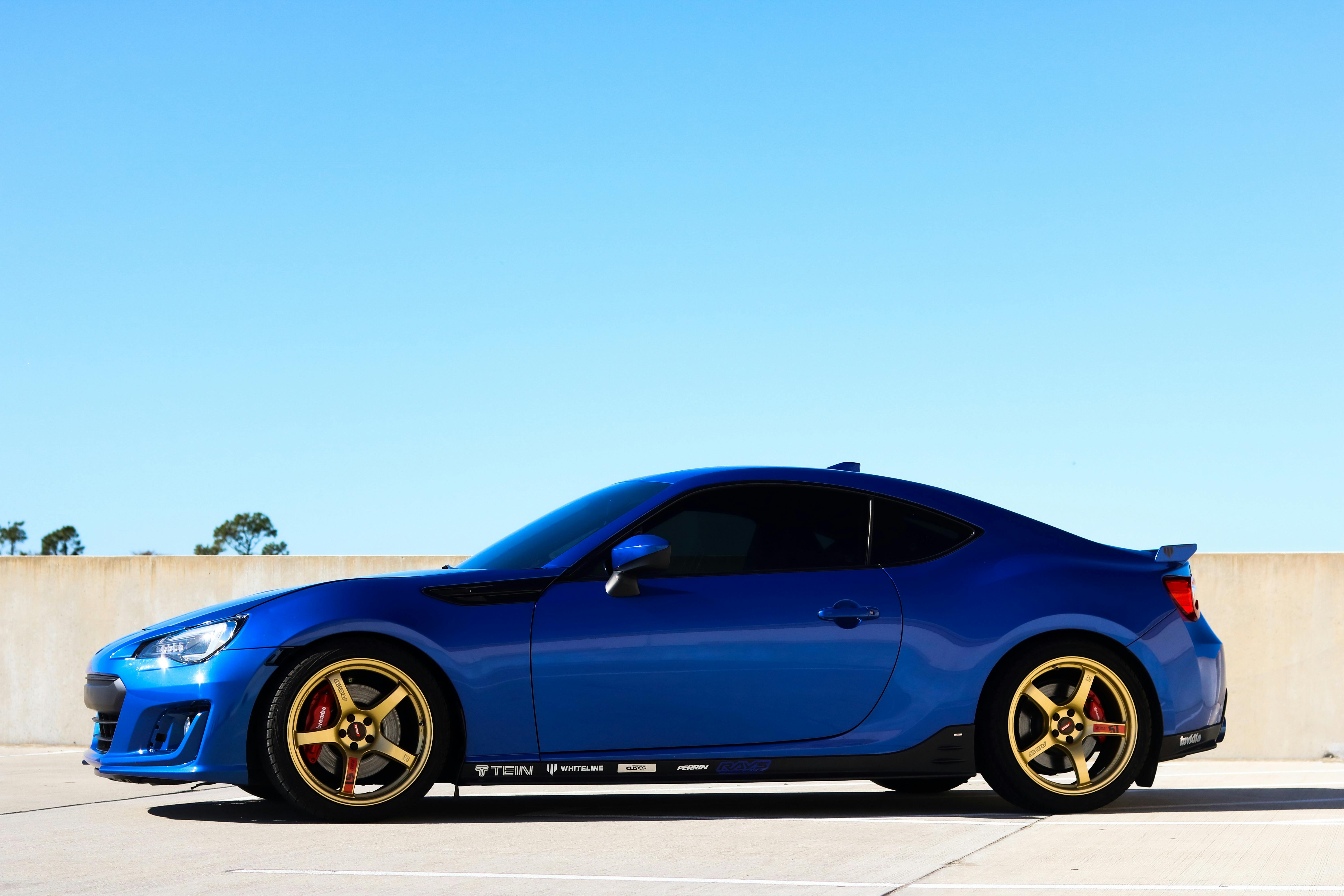 Clear Sky over Blue Car · Free Stock Photo