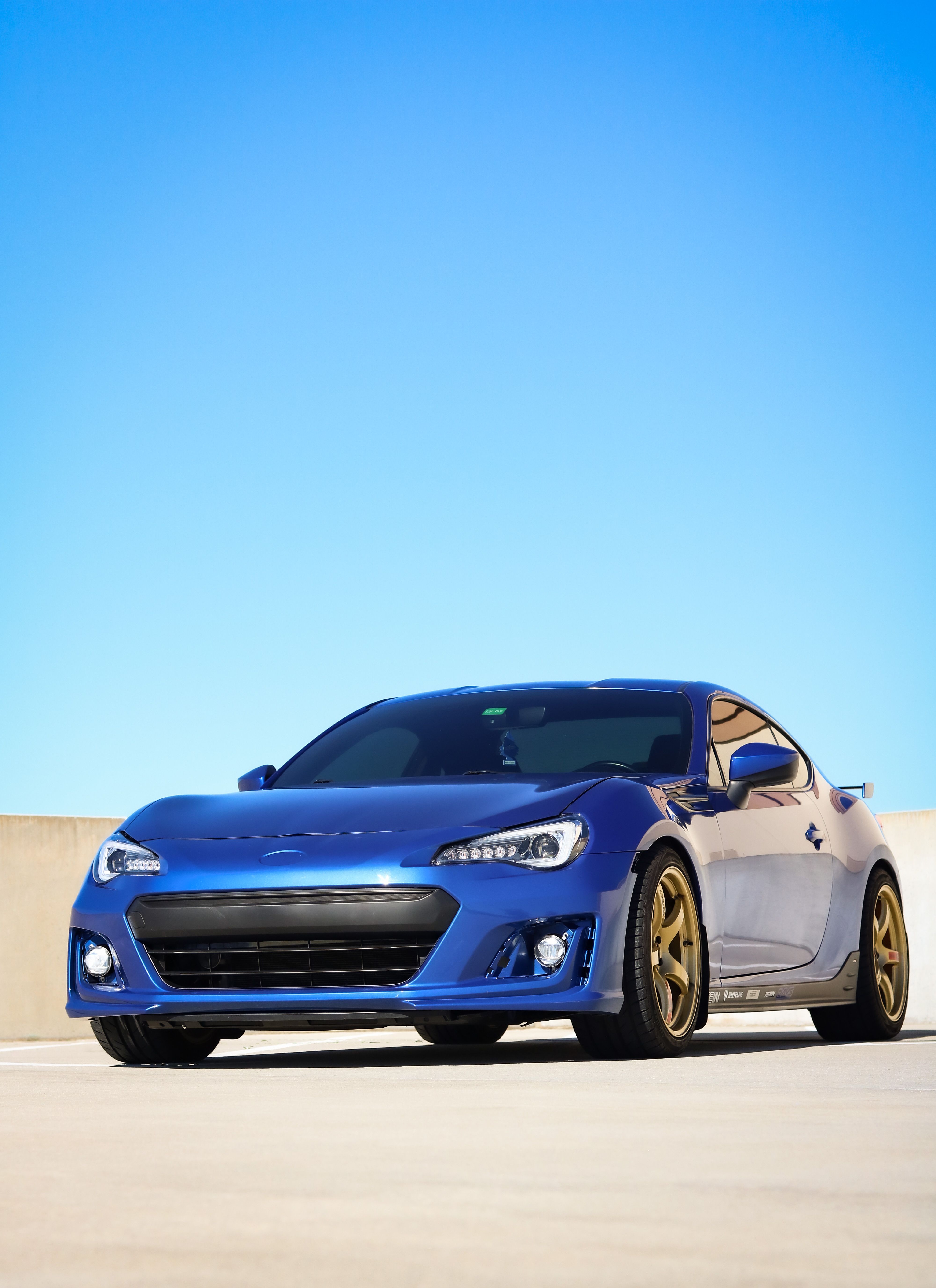 Blue Sports Car under Clear Sky · Free Stock Photo