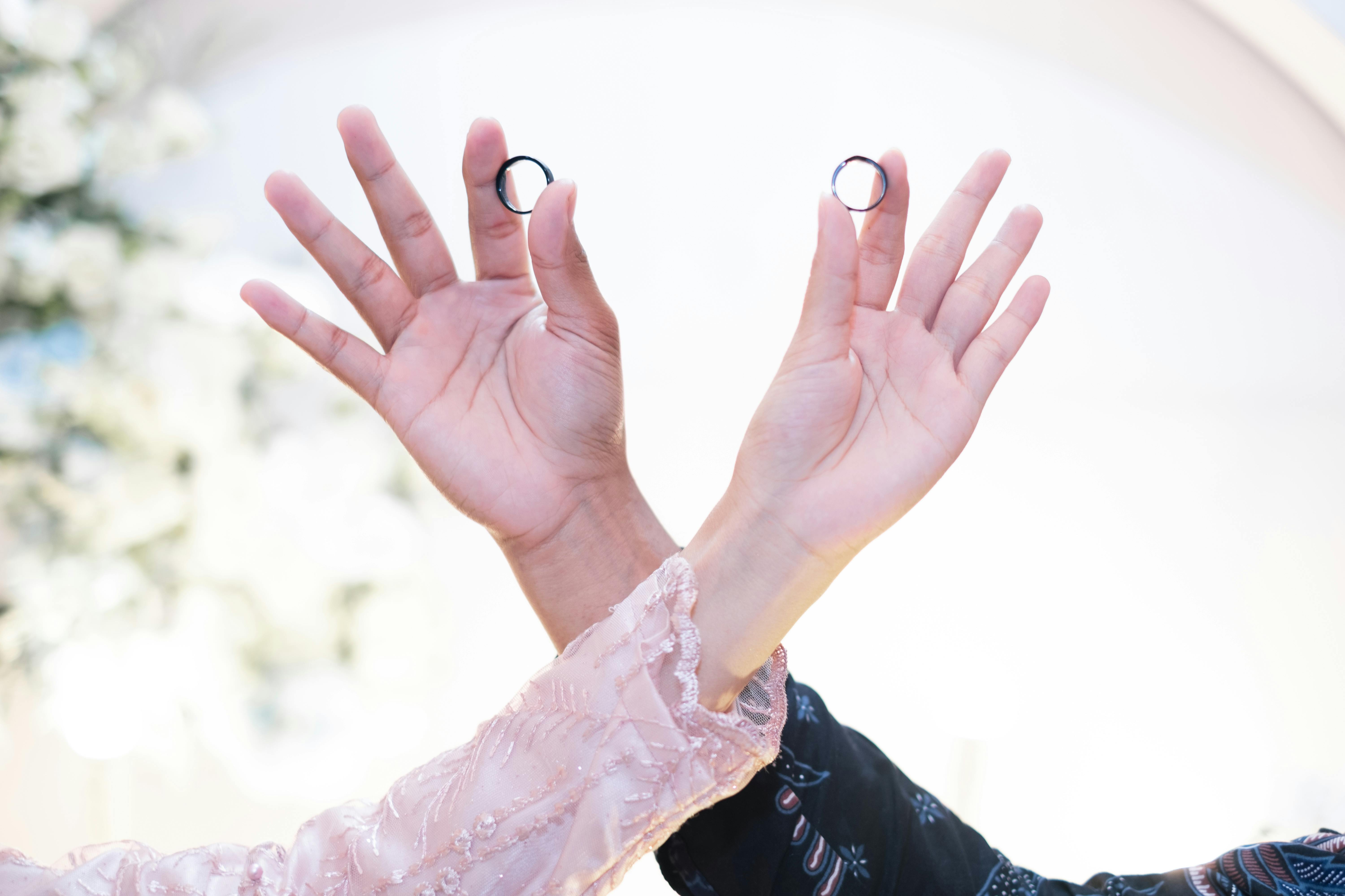 A Couple Holding Rings · Free Stock Photo