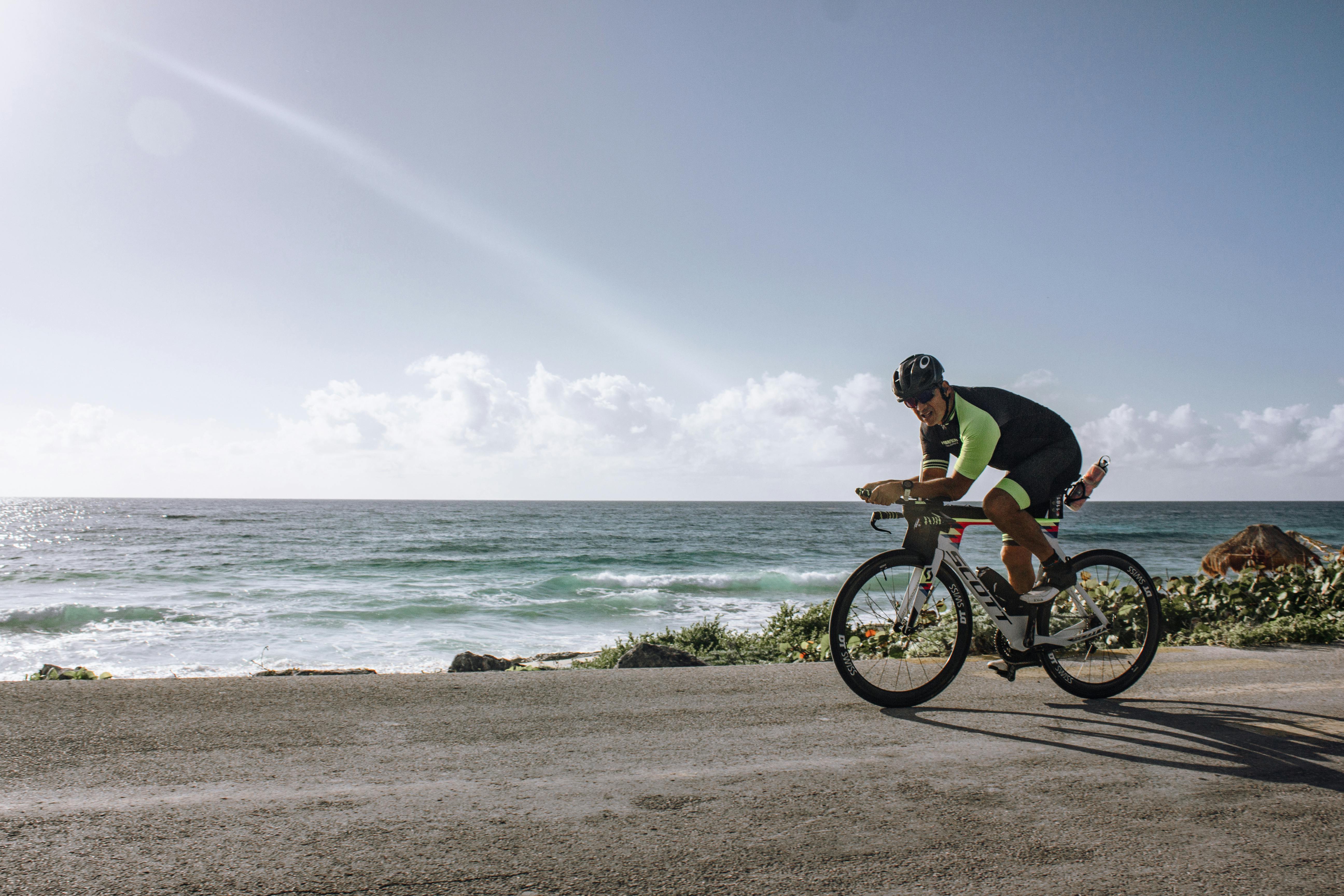 Man Biking on Road · Free Stock Photo