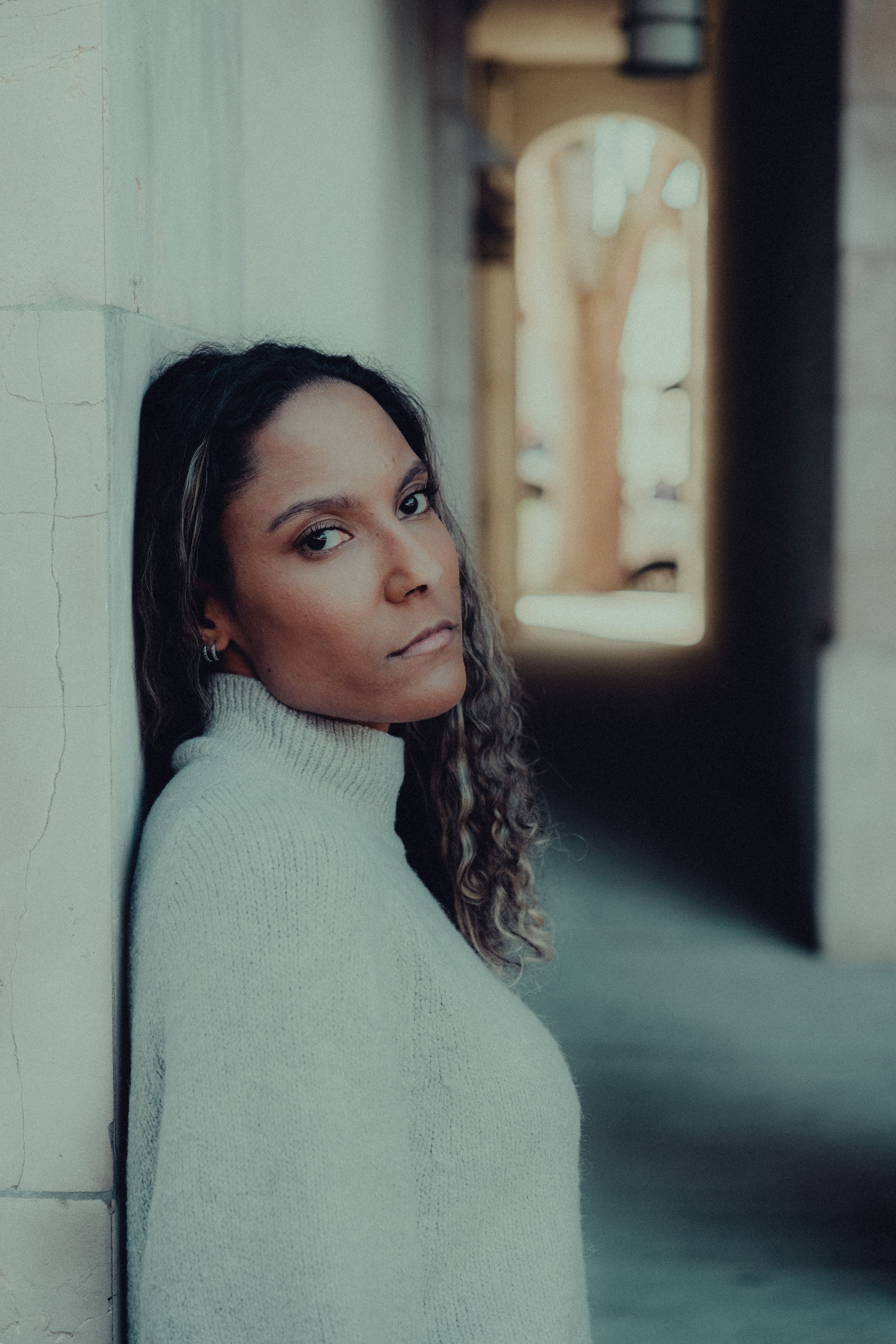 Woman Standing with Her Back against the Wall · Free Stock Photo