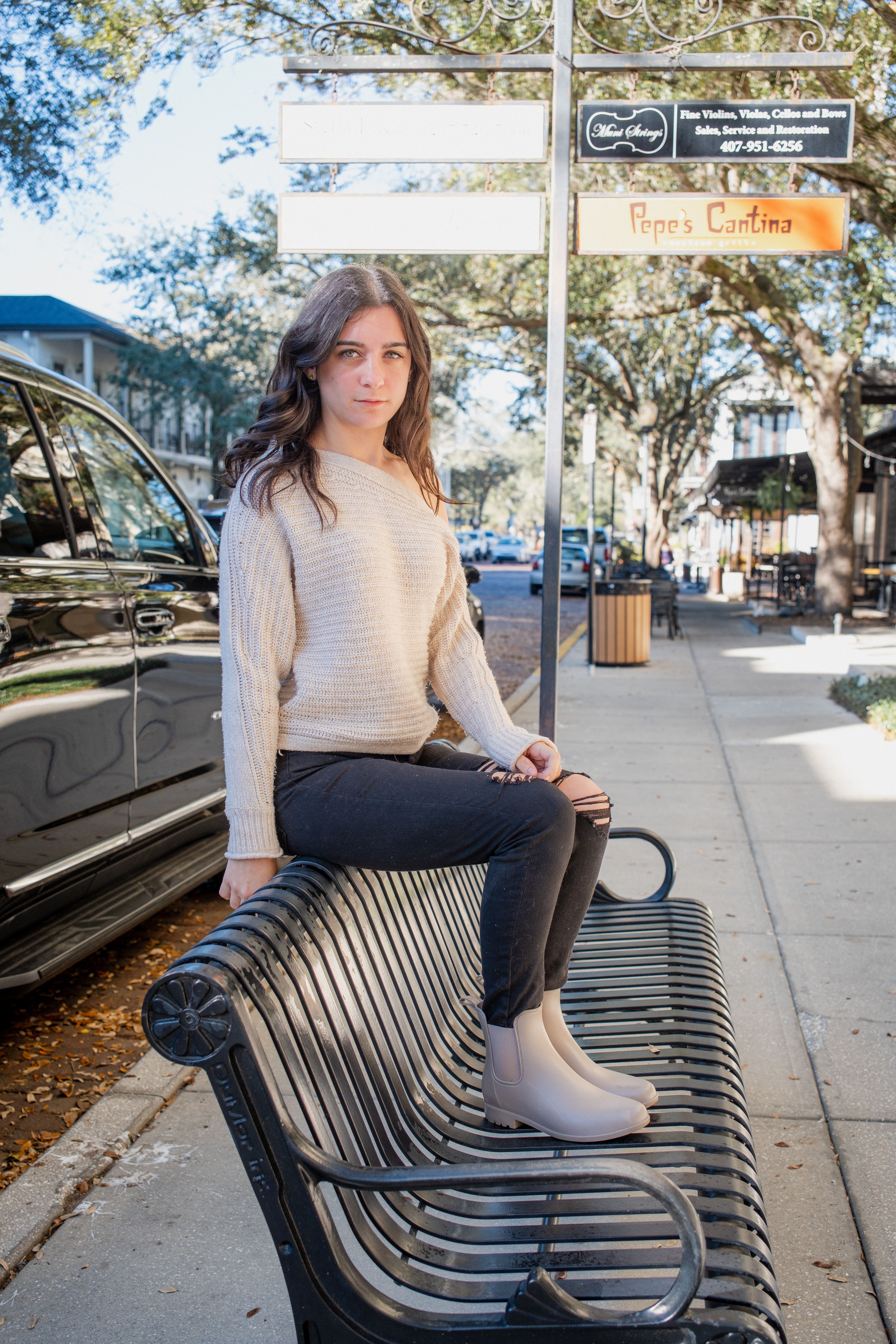 Woman in White Sweater sitting on a Bench · Free Stock Photo