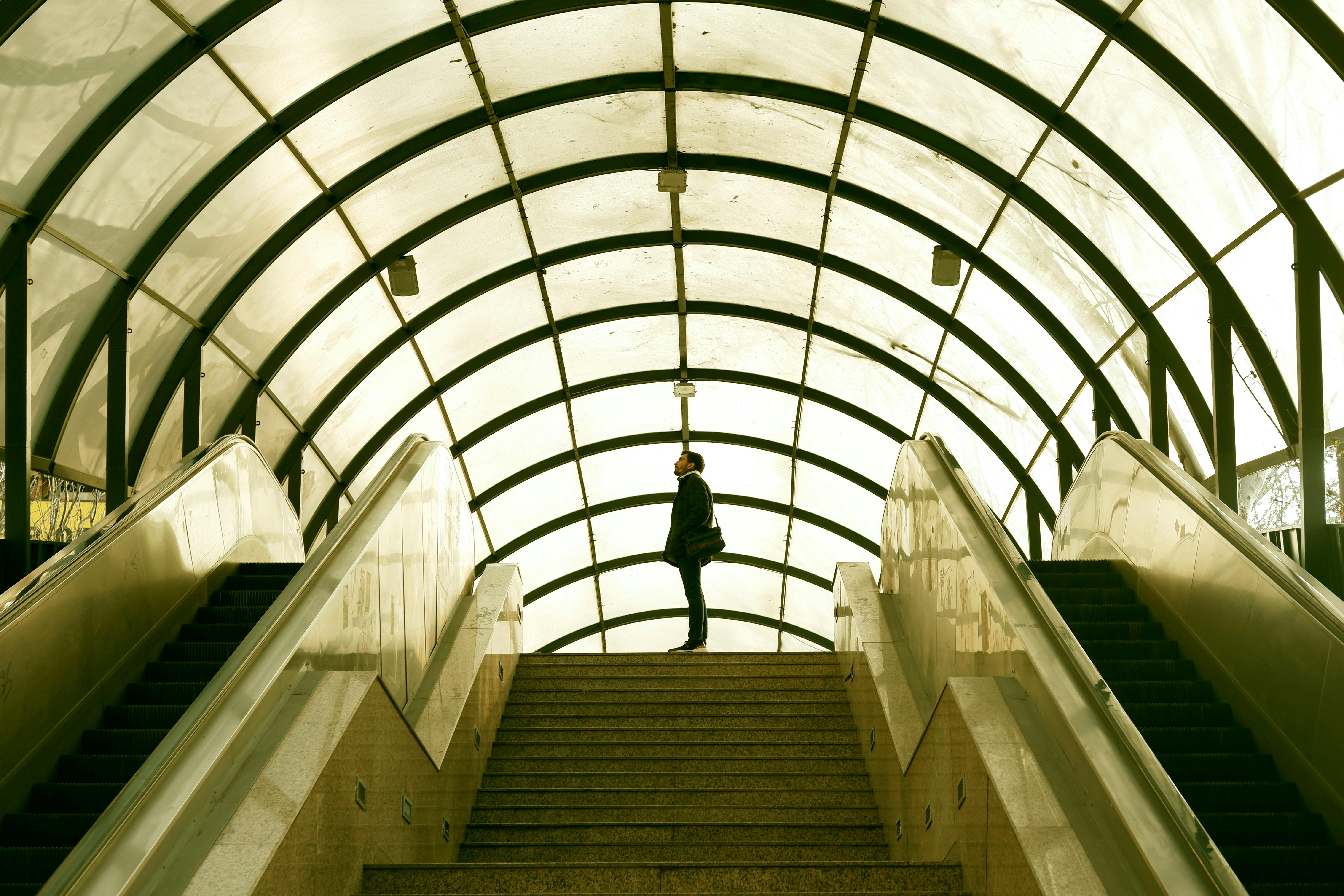 Person Standing at Top of Stairs · Free Stock Photo