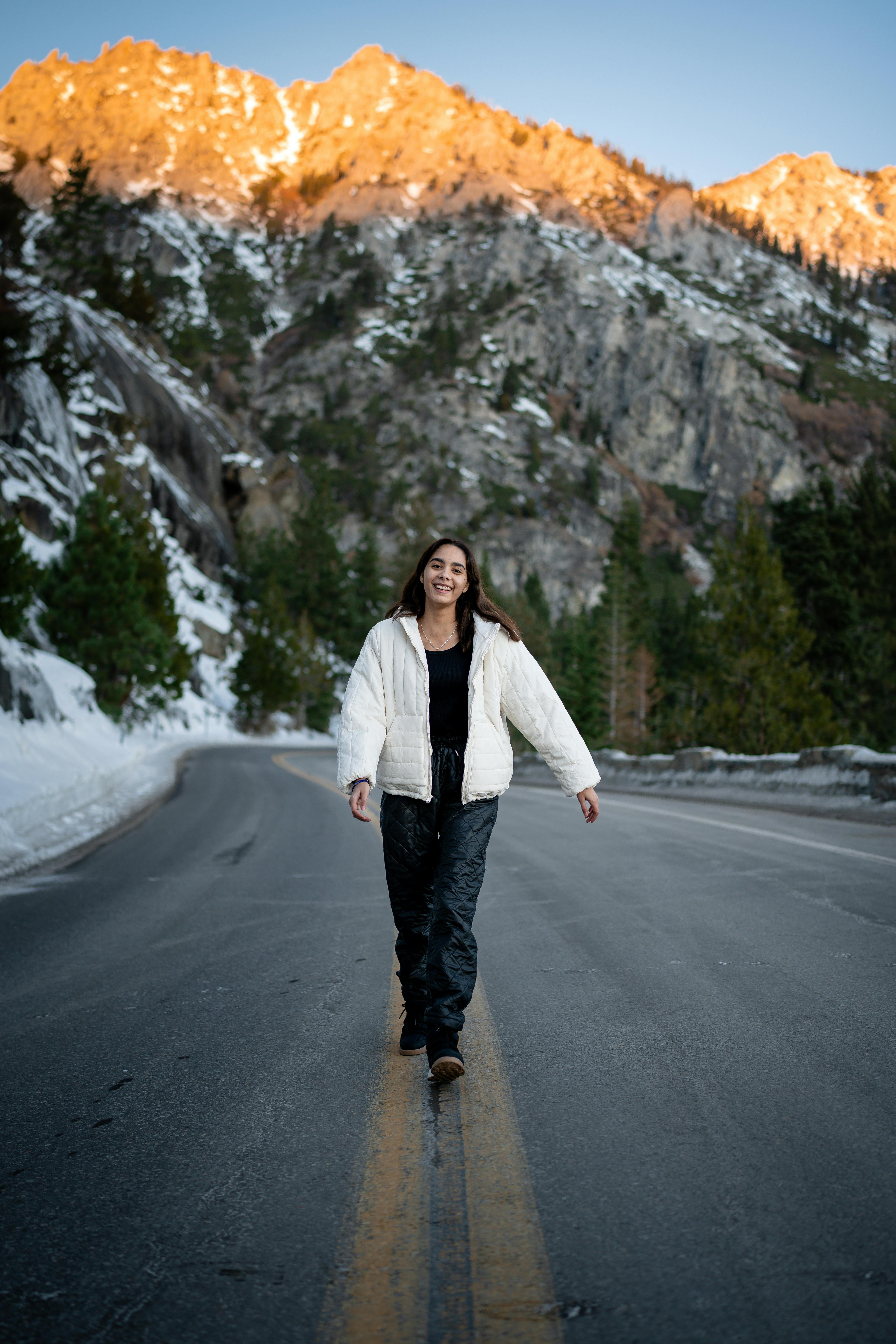 Portrait of a Woman Standing on a Road · Free Stock Photo