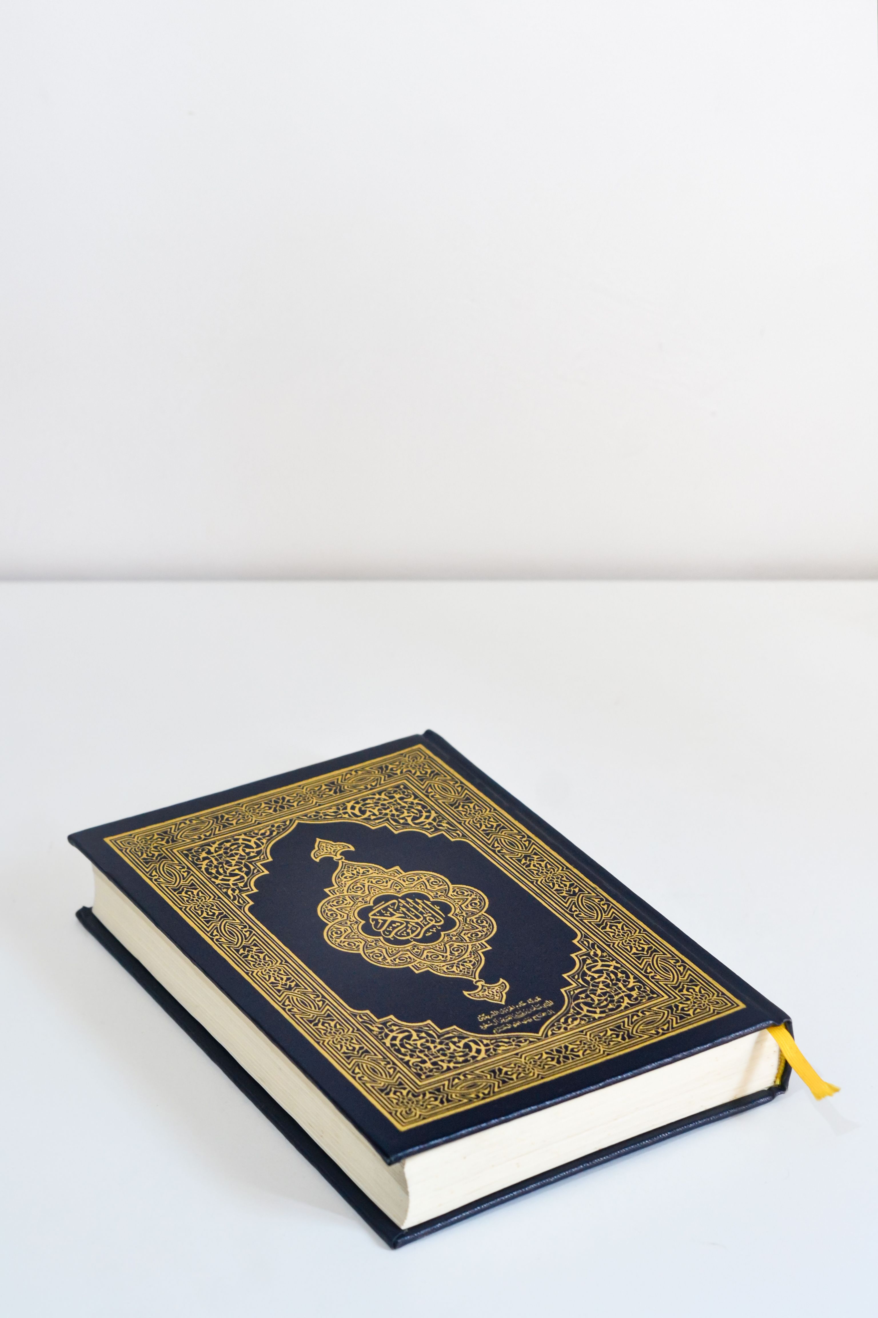 Quran in a Navy Blue Cover with a Decorative Golden Pattern · Free ...