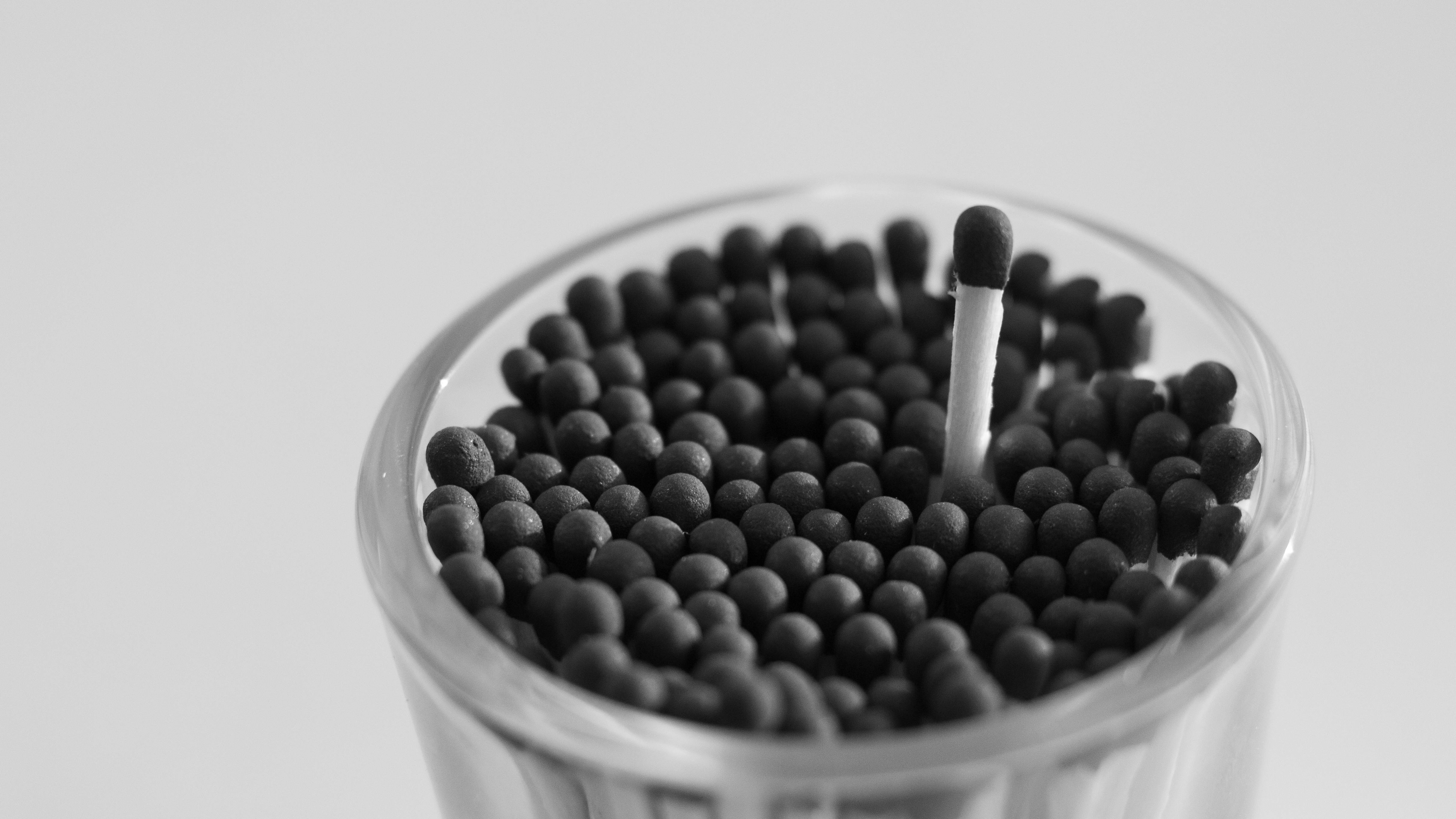 Black Matches in Glass · Free Stock Photo